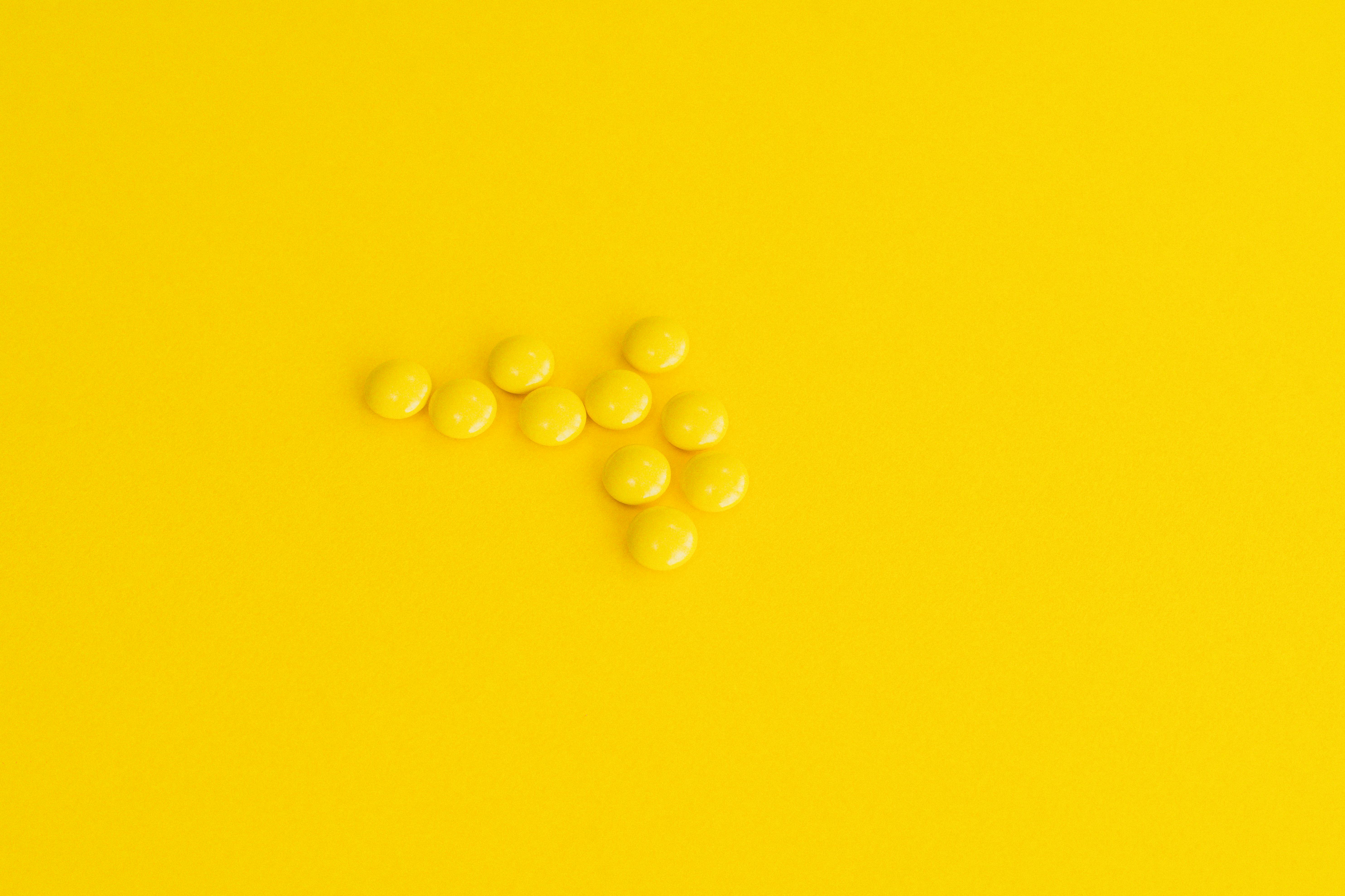 Prescription Drugs on Yellow Surface · Free Stock Photo
