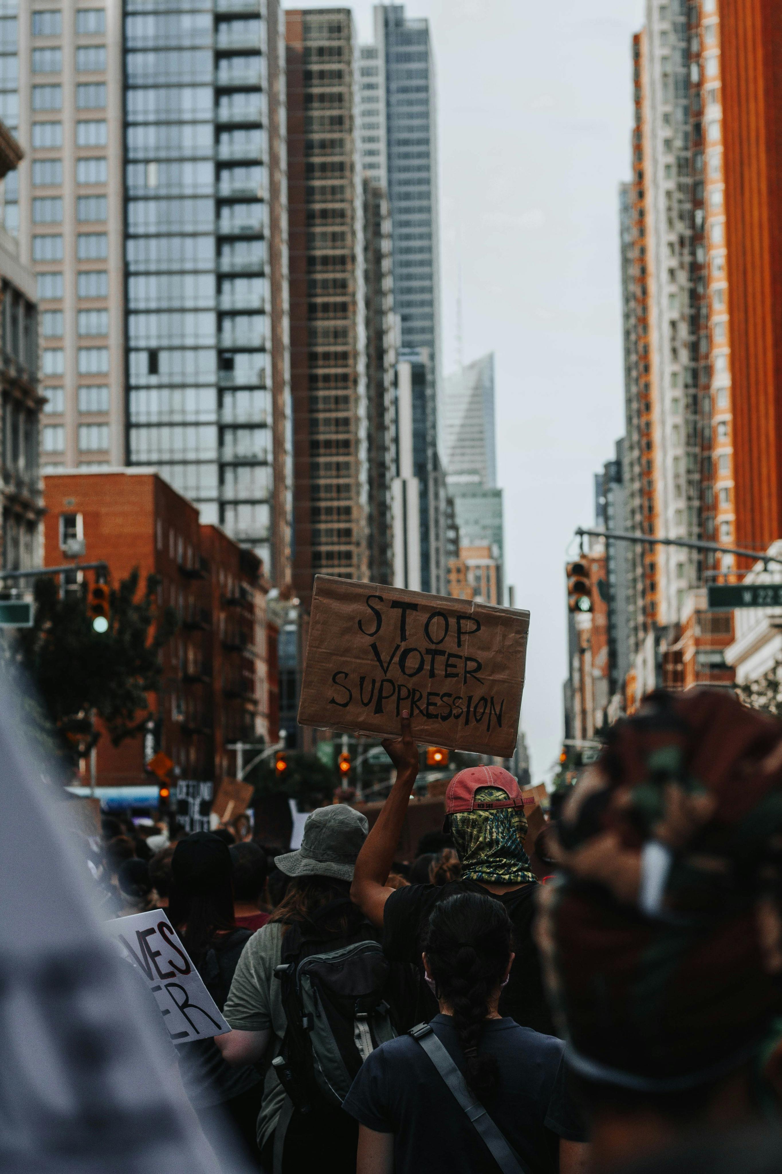 People Rallying Carrying on Strike Signage · Free Stock Photo