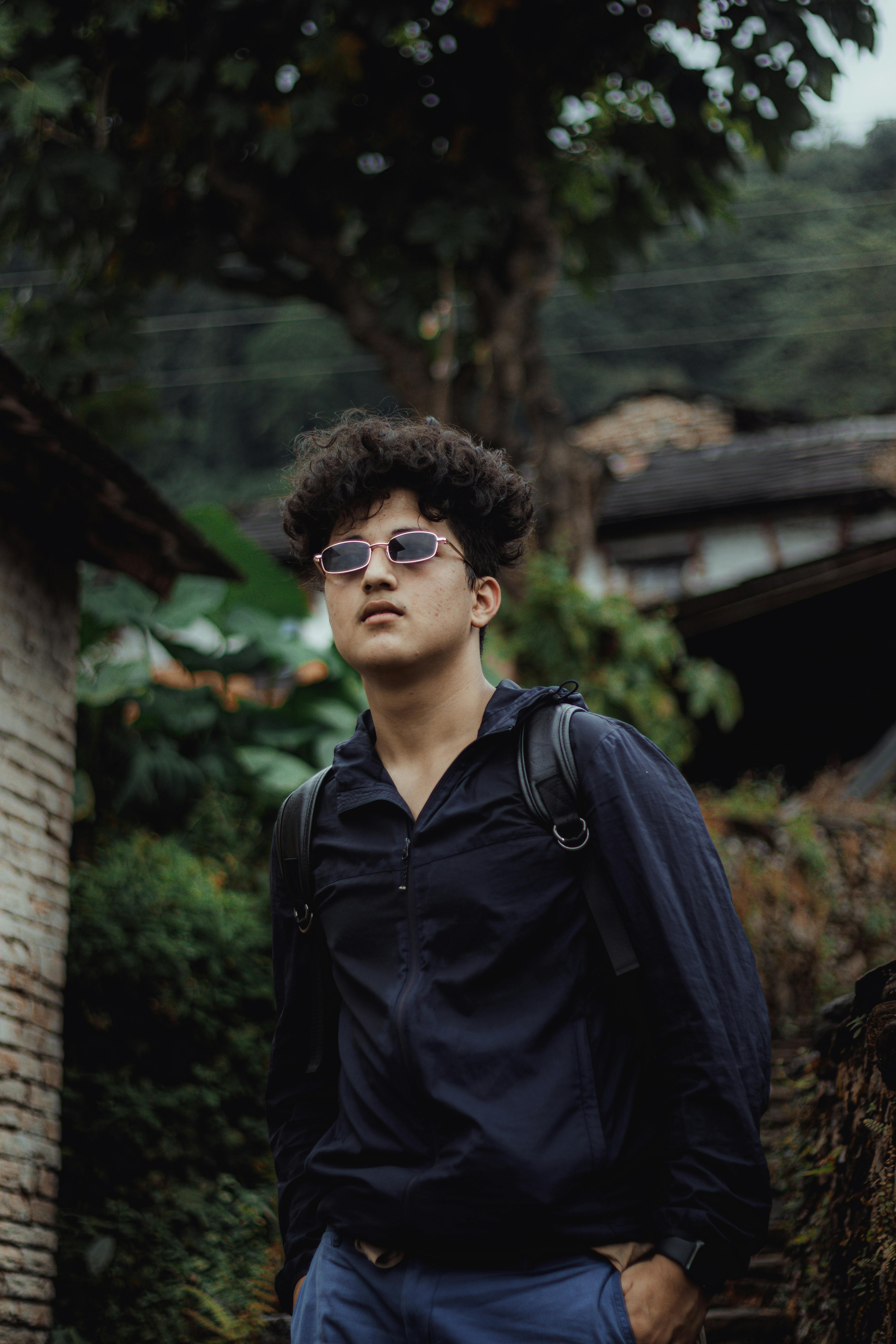 A Man Carrying a Backpack · Free Stock Photo