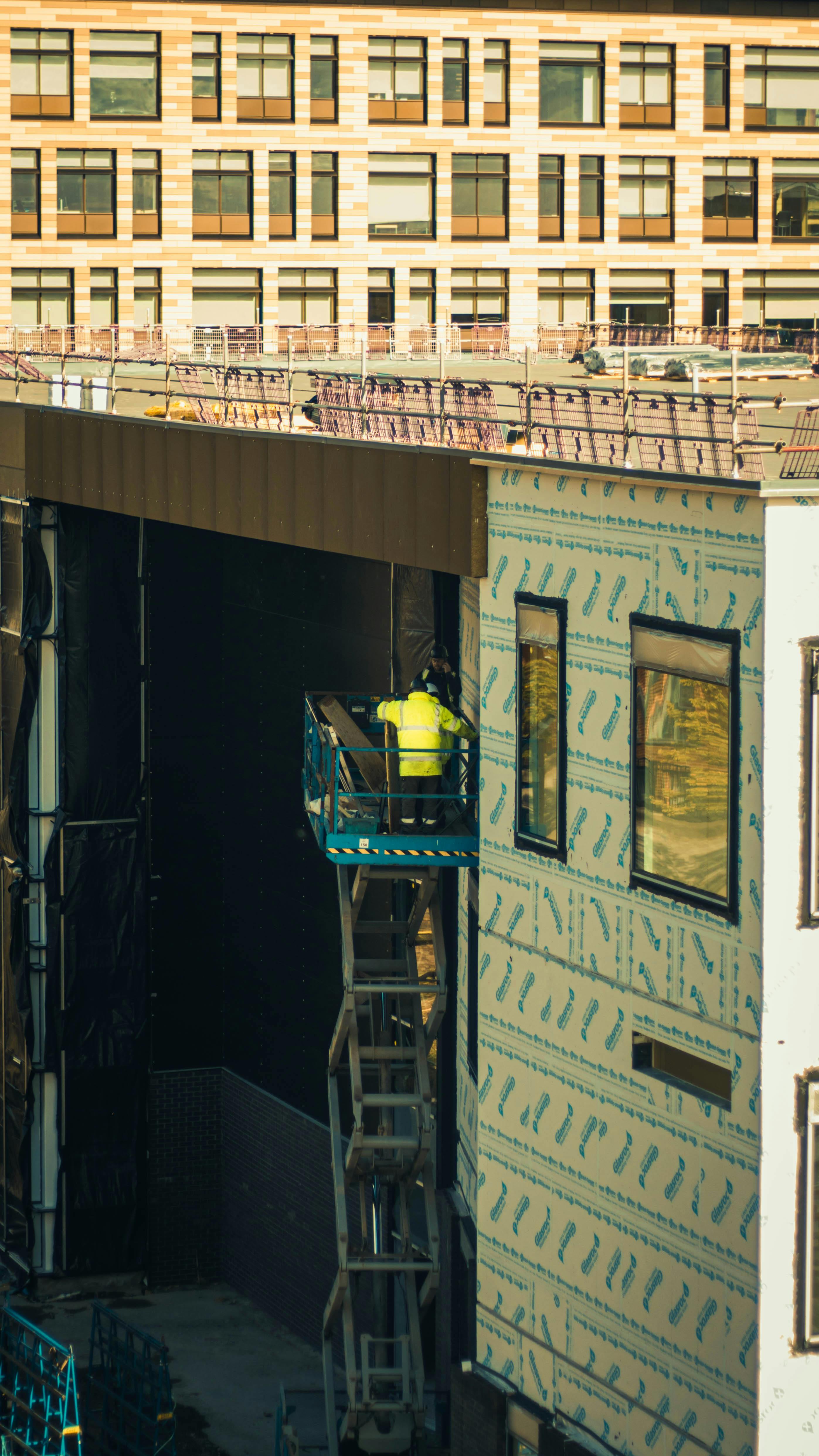 Cement flowing at construction site · Free Stock Photo