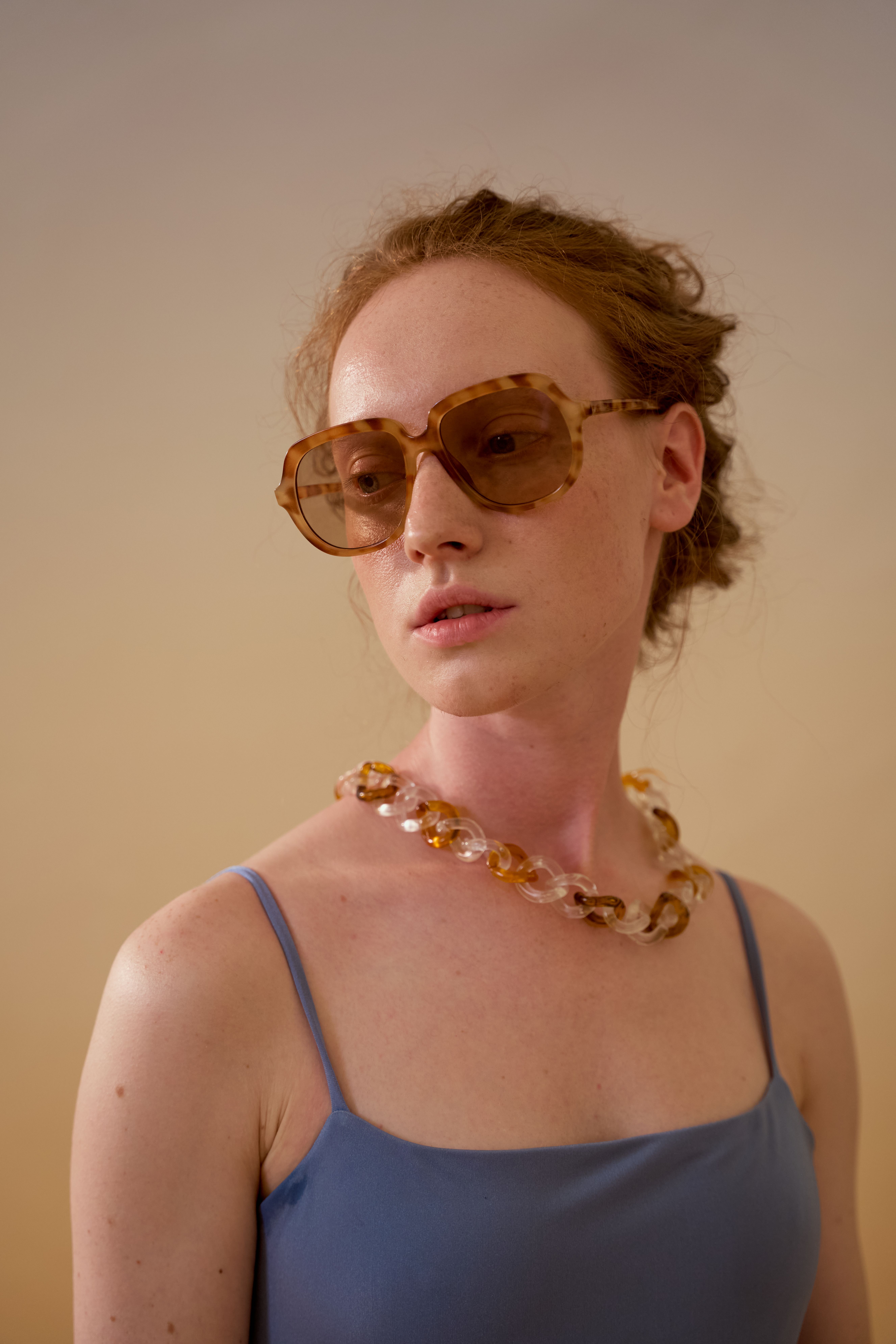 Woman in Blue Spaghetti Strap Top with Brown Sunglasses and Crystal ...
