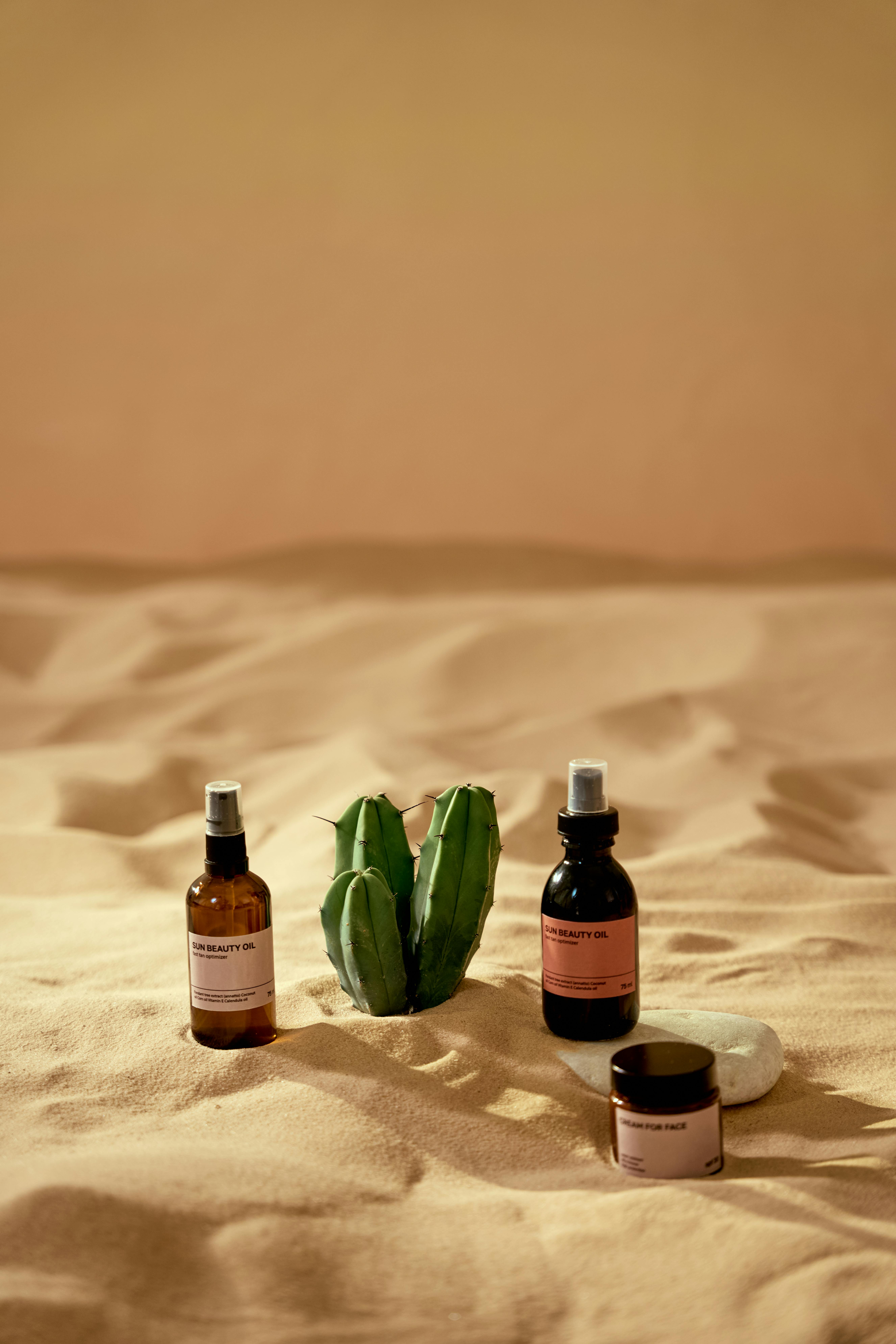Cosmetic Products on a Beach Sand · Free Stock Photo