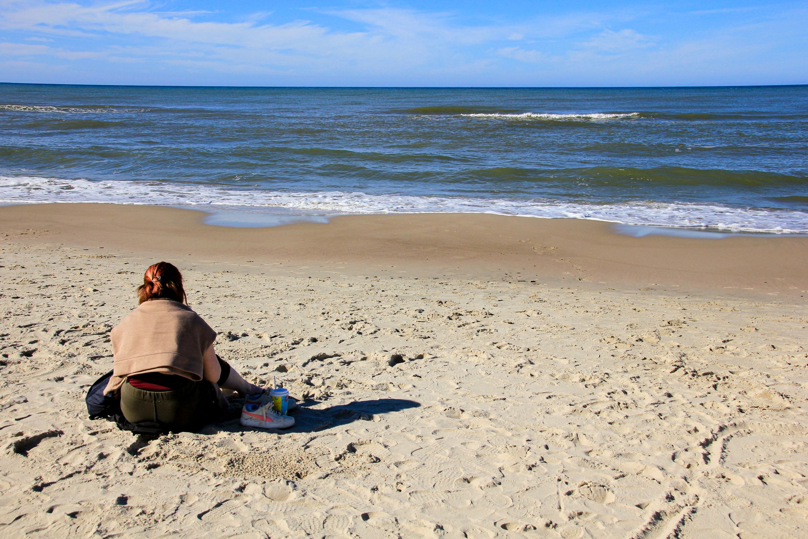 A Woman Writing Numbers on Sand with Her Hand · Free Stock Photo