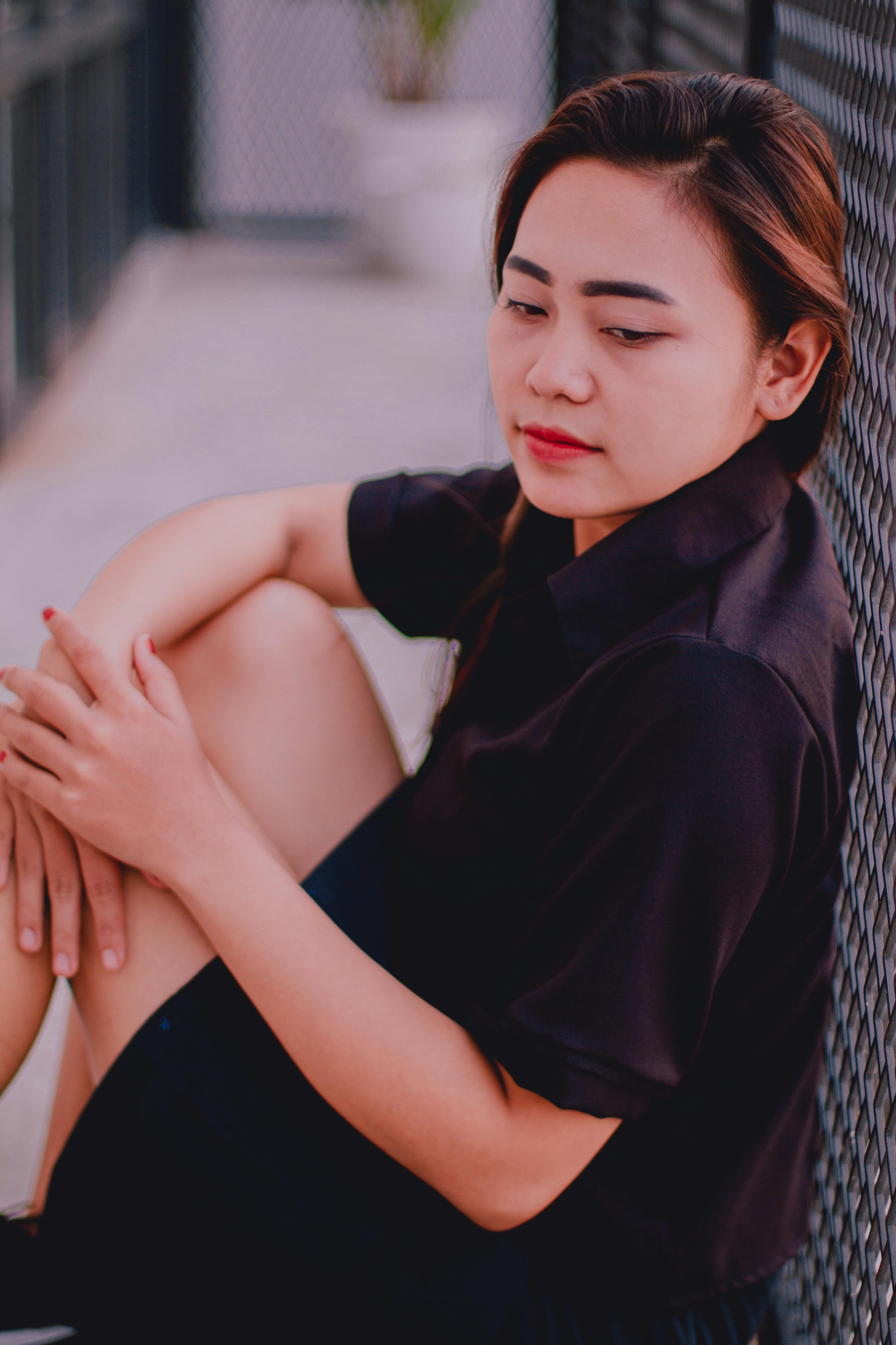 Legs of Two People Sitting Side by Side on the Floor · Free Stock Photo