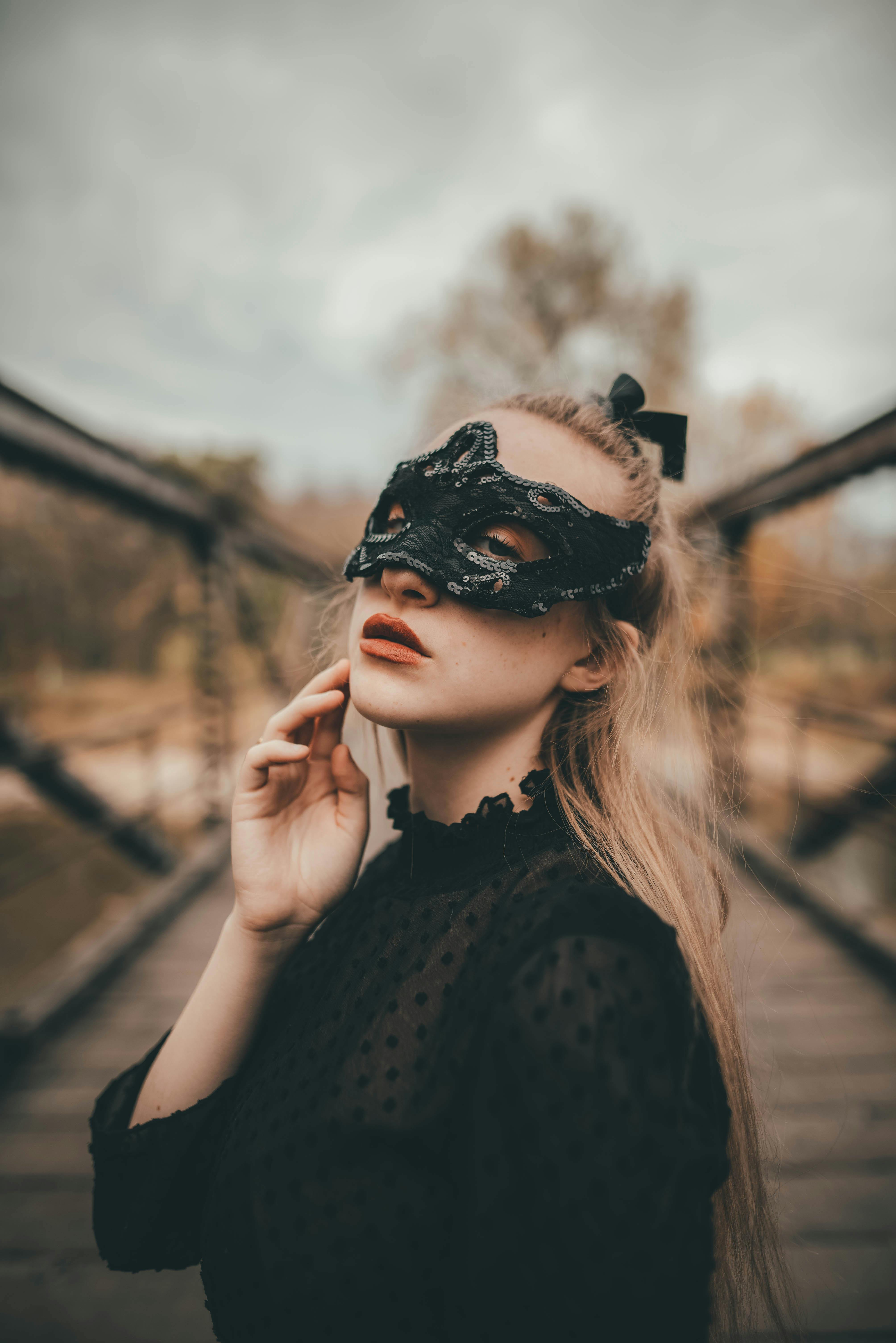 Portrait of female model with black mask · Free Stock Photo