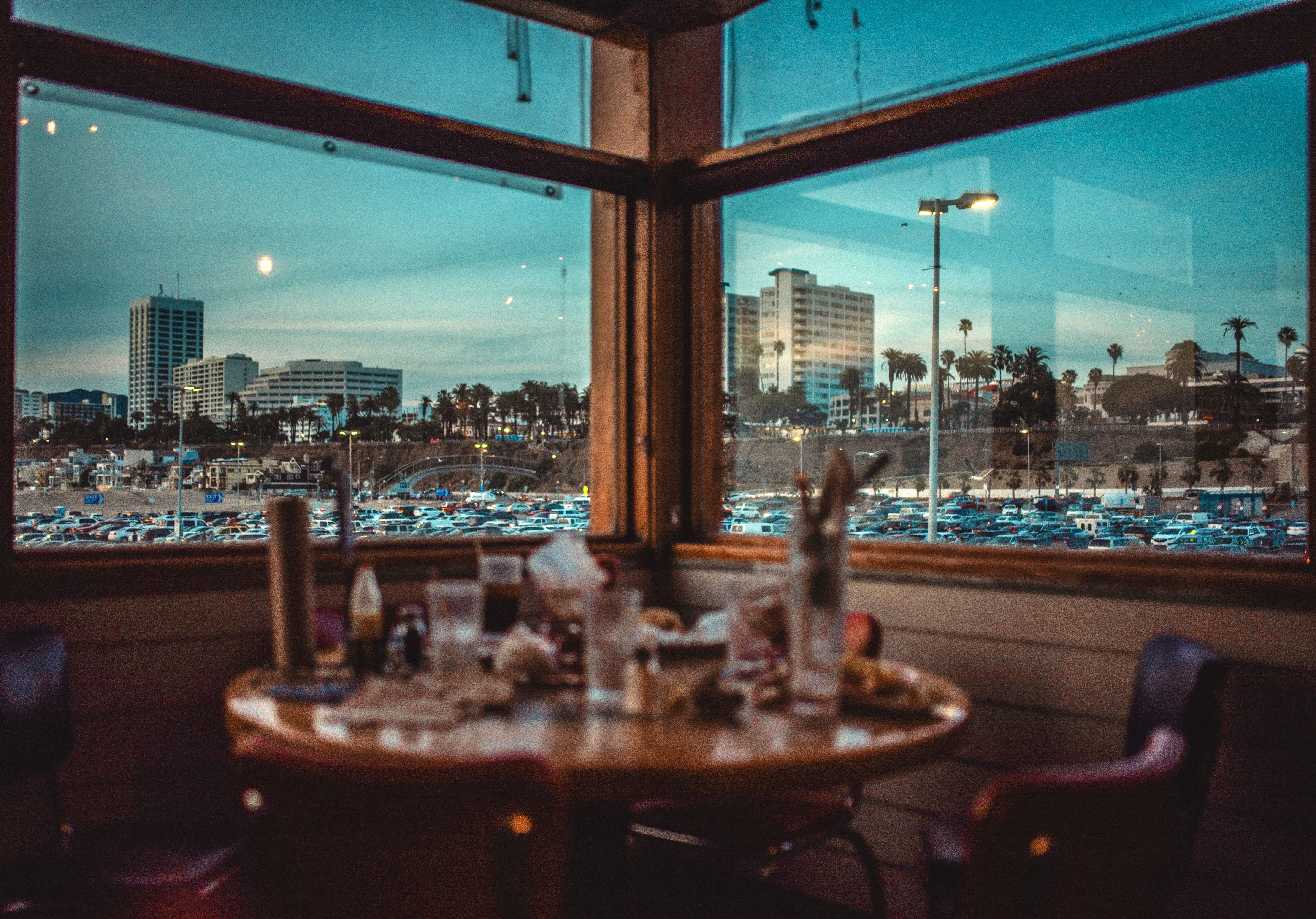 View of City Buildings and Parking Lot from a Restaurant · Free Stock Photo