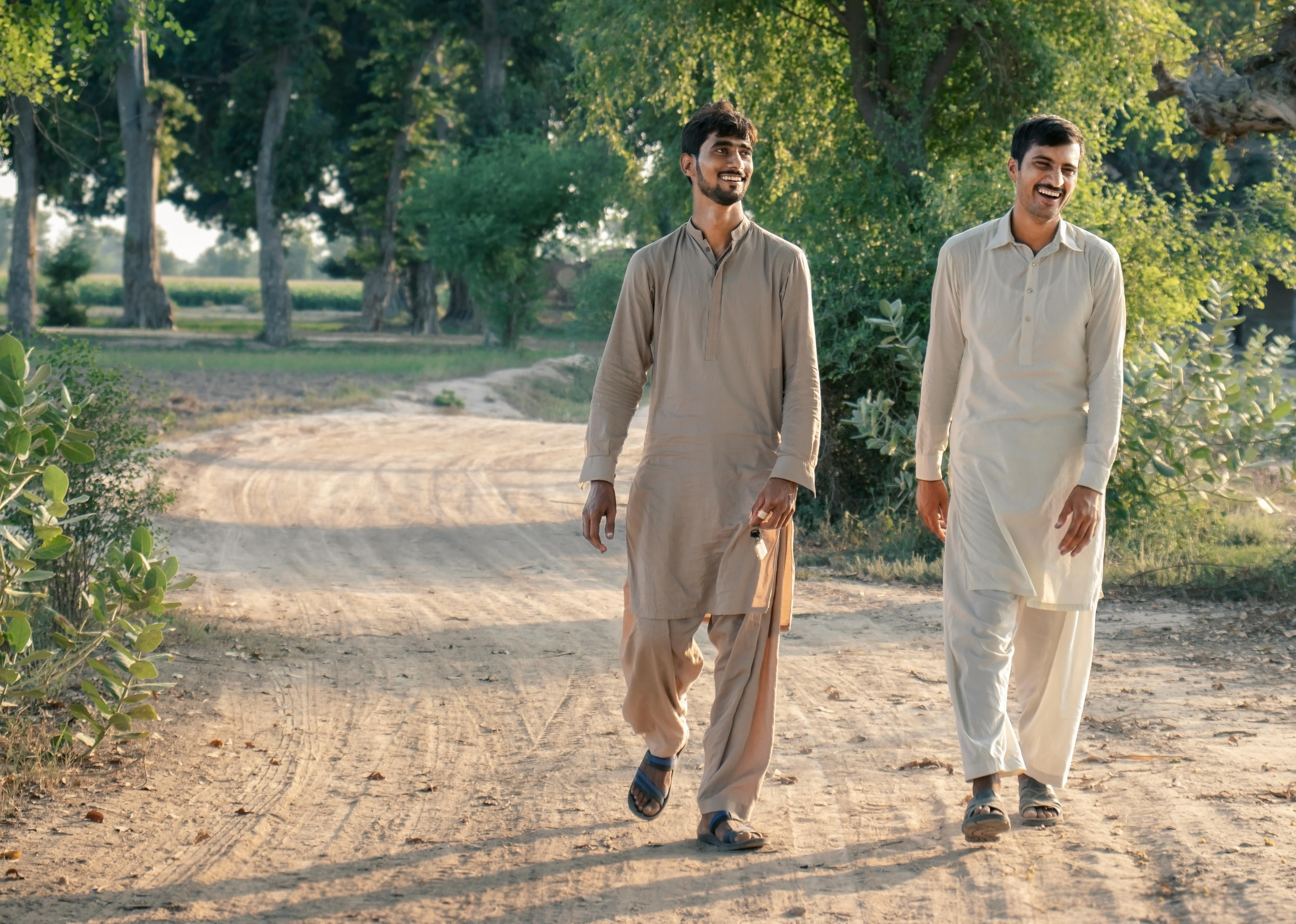 Two Men Walking Together · Free Stock Photo