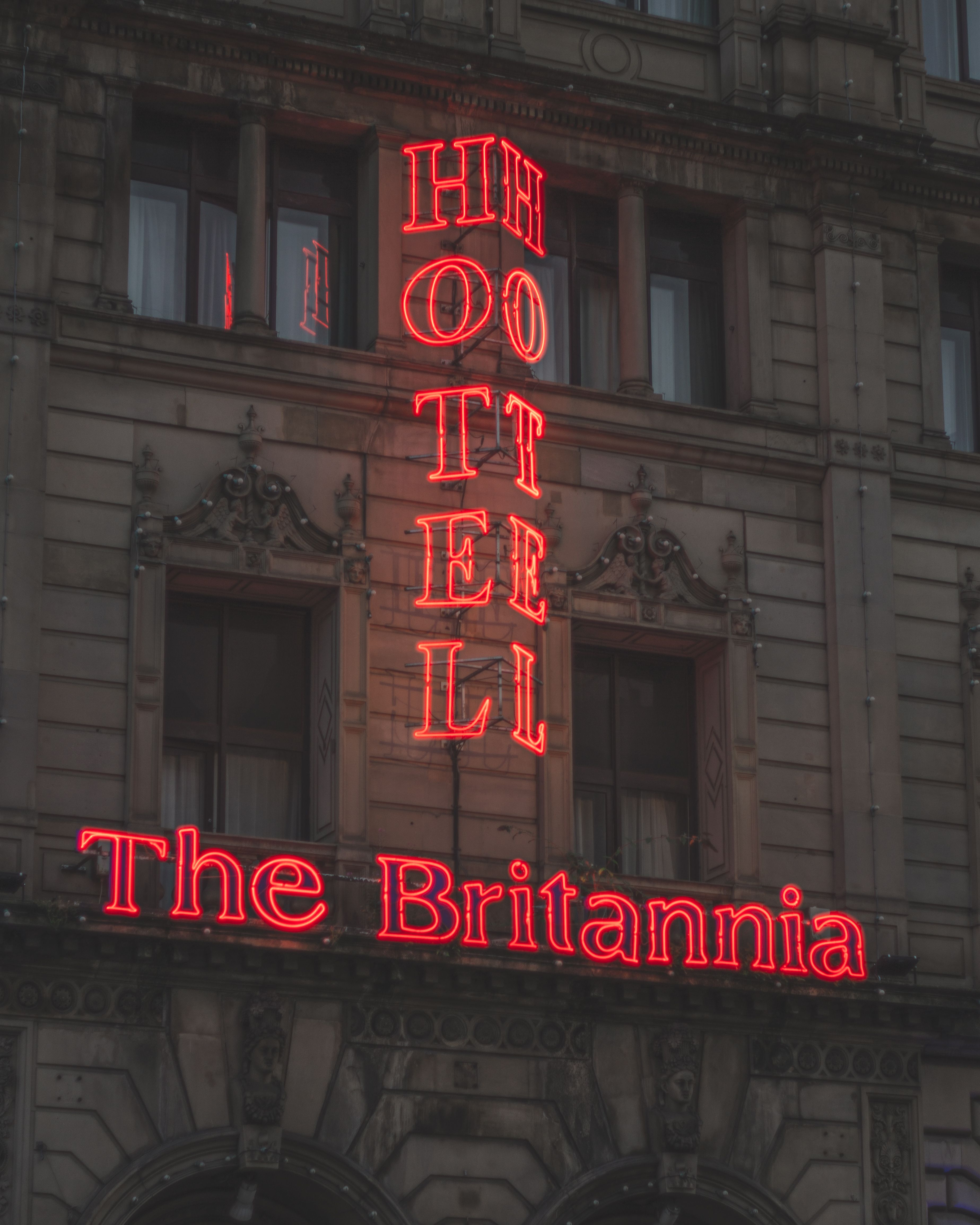 An Illuminated Signage of a Hotel · Free Stock Photo