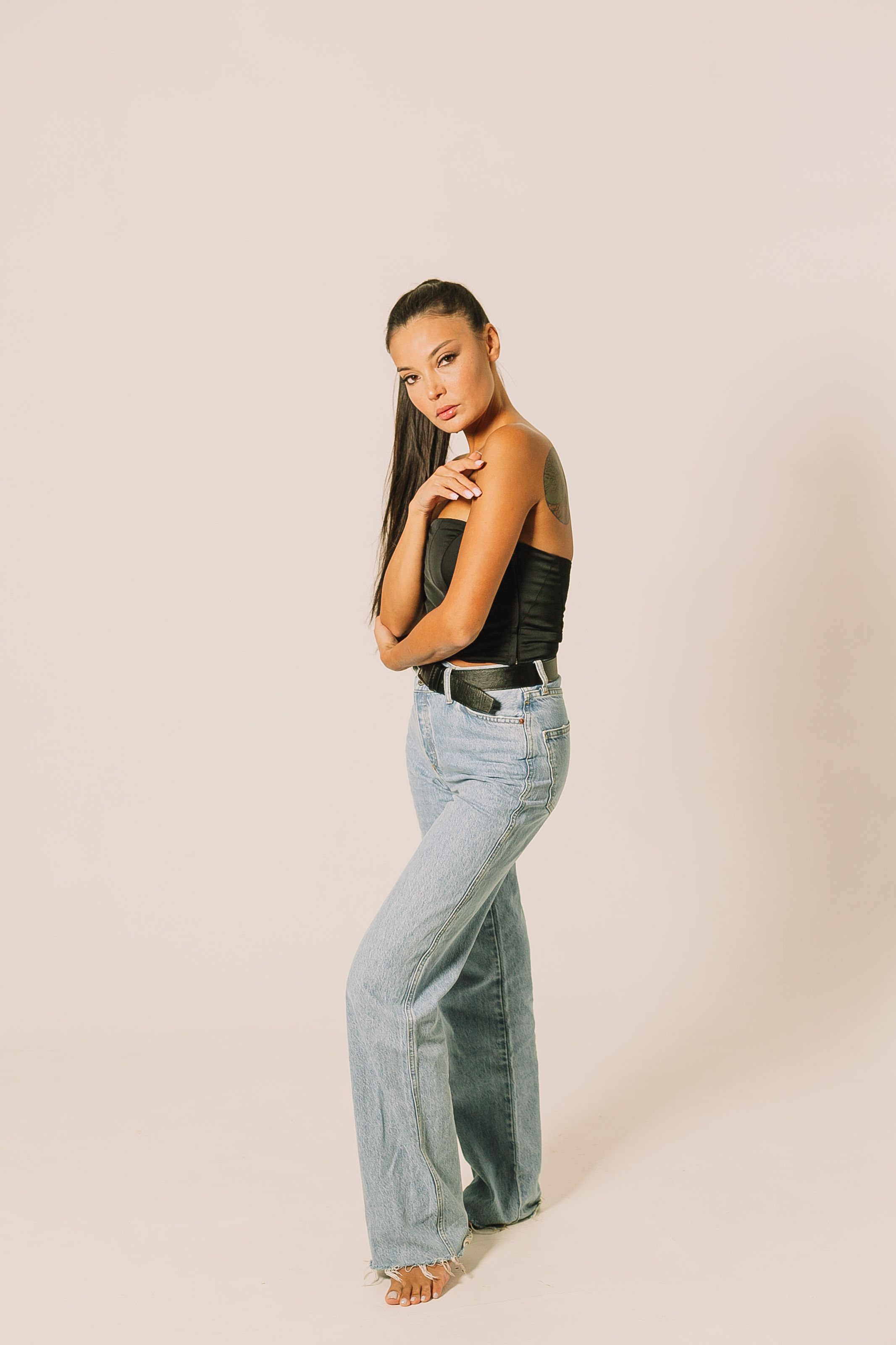 Model Posing in Jeans · Free Stock Photo