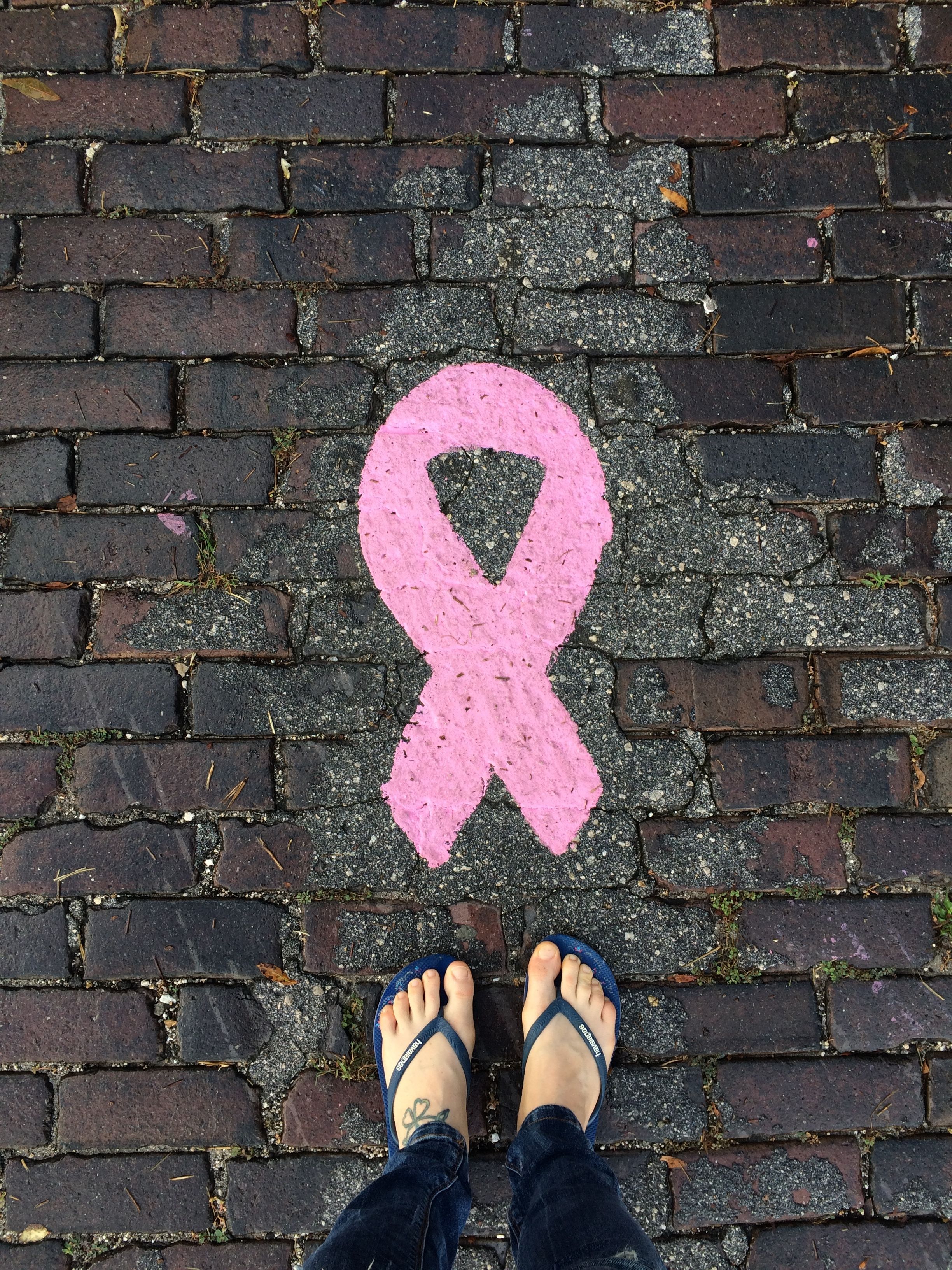Woman Standing next to a Pink Sign · Free Stock Photo