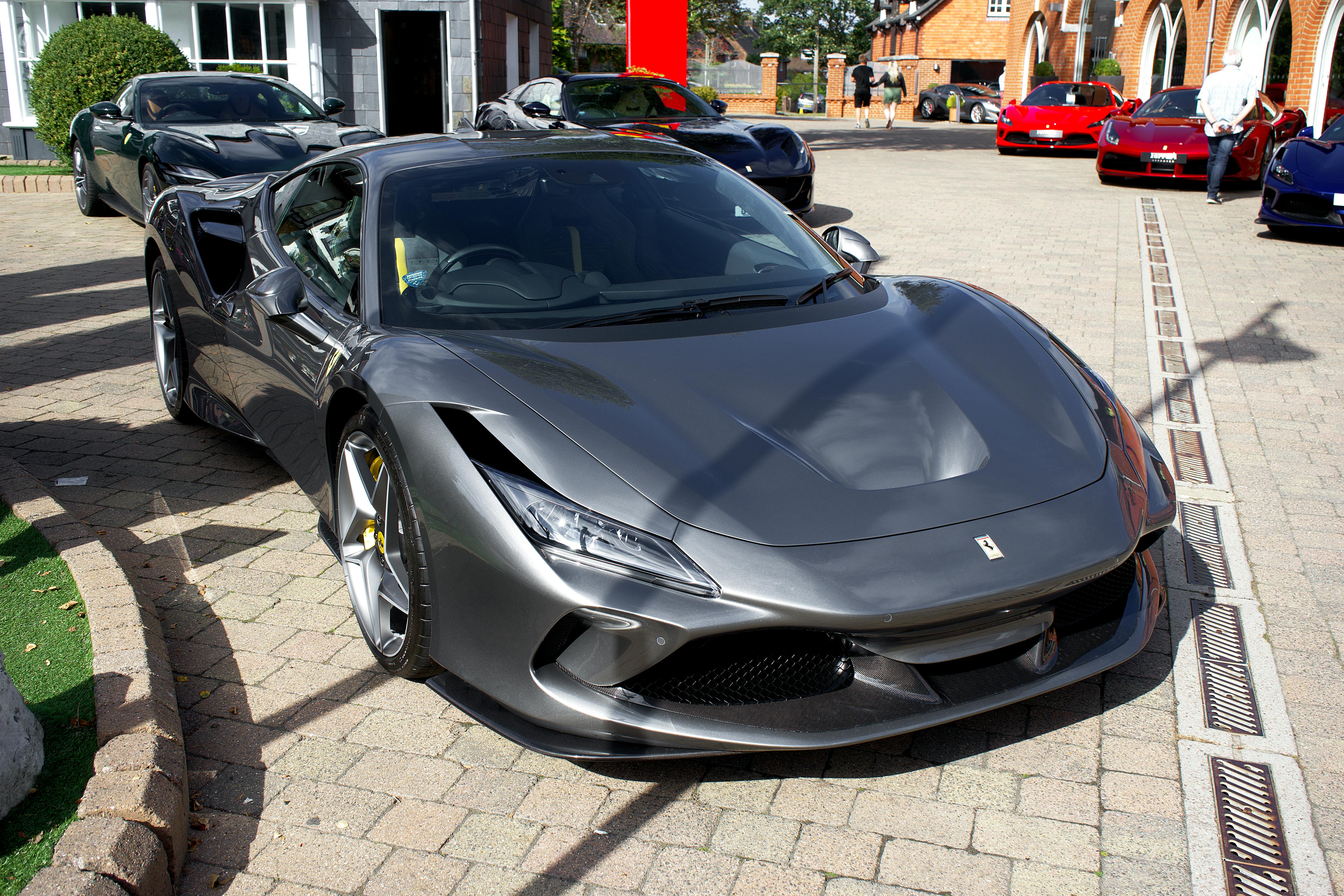 Parked Gray Ferrari F8 on Pavement · Free Stock Photo