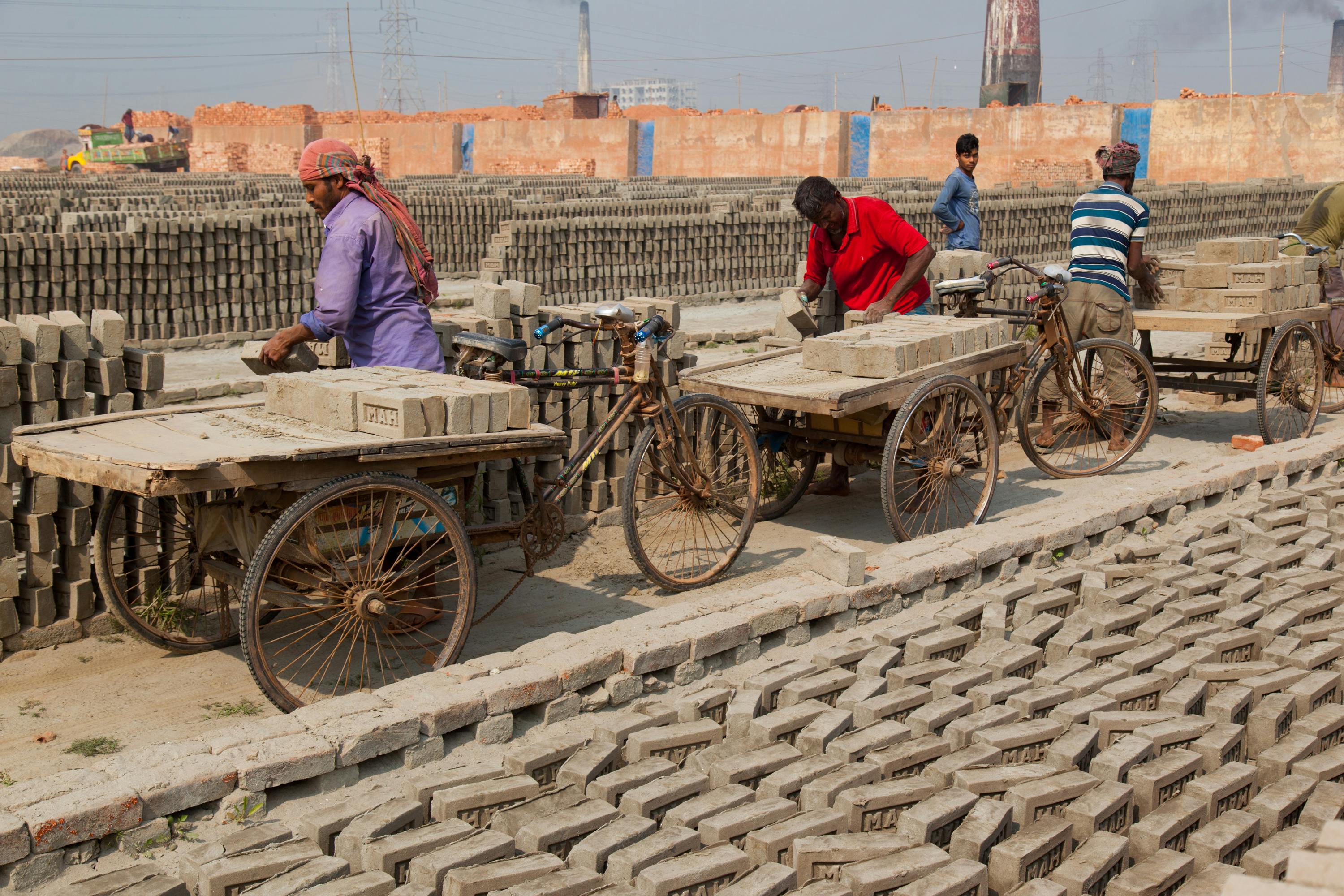 Workers and Carts at Brick Field · Free Stock Photo