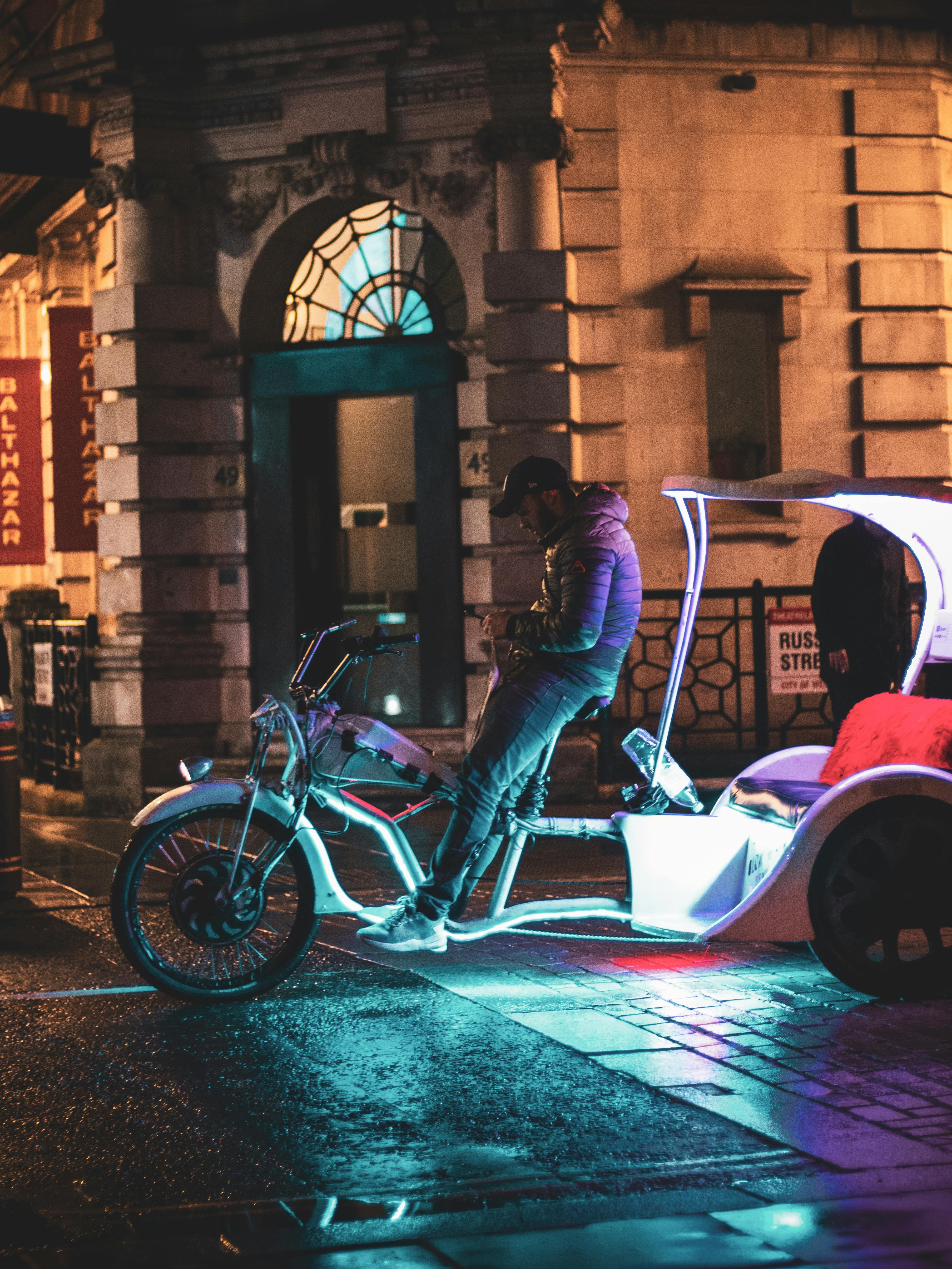 A Man Riding a Tricycle · Free Stock Photo