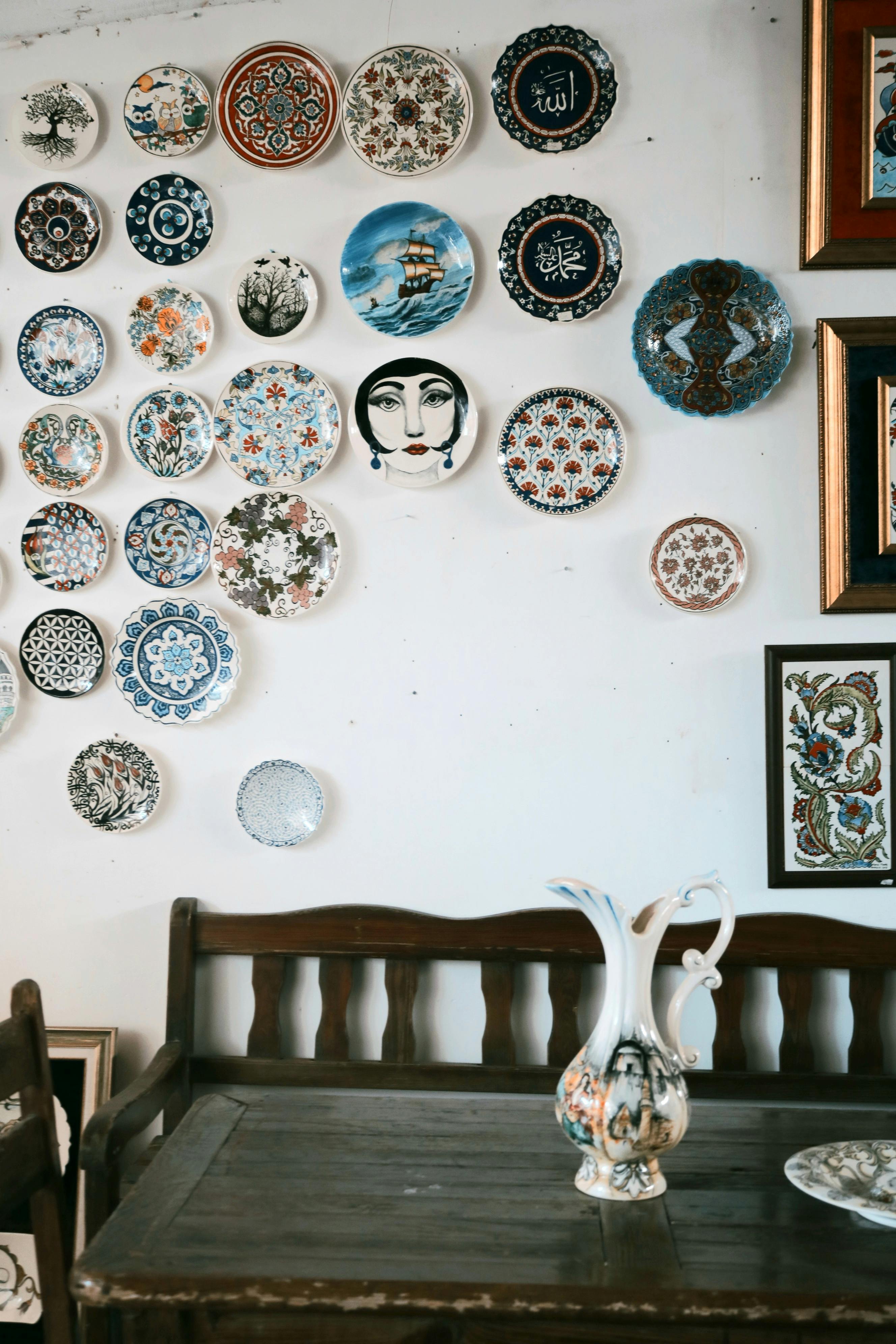 Ceramic Plate Display on Brown Wooden Shelves on Wall · Free Stock Photo