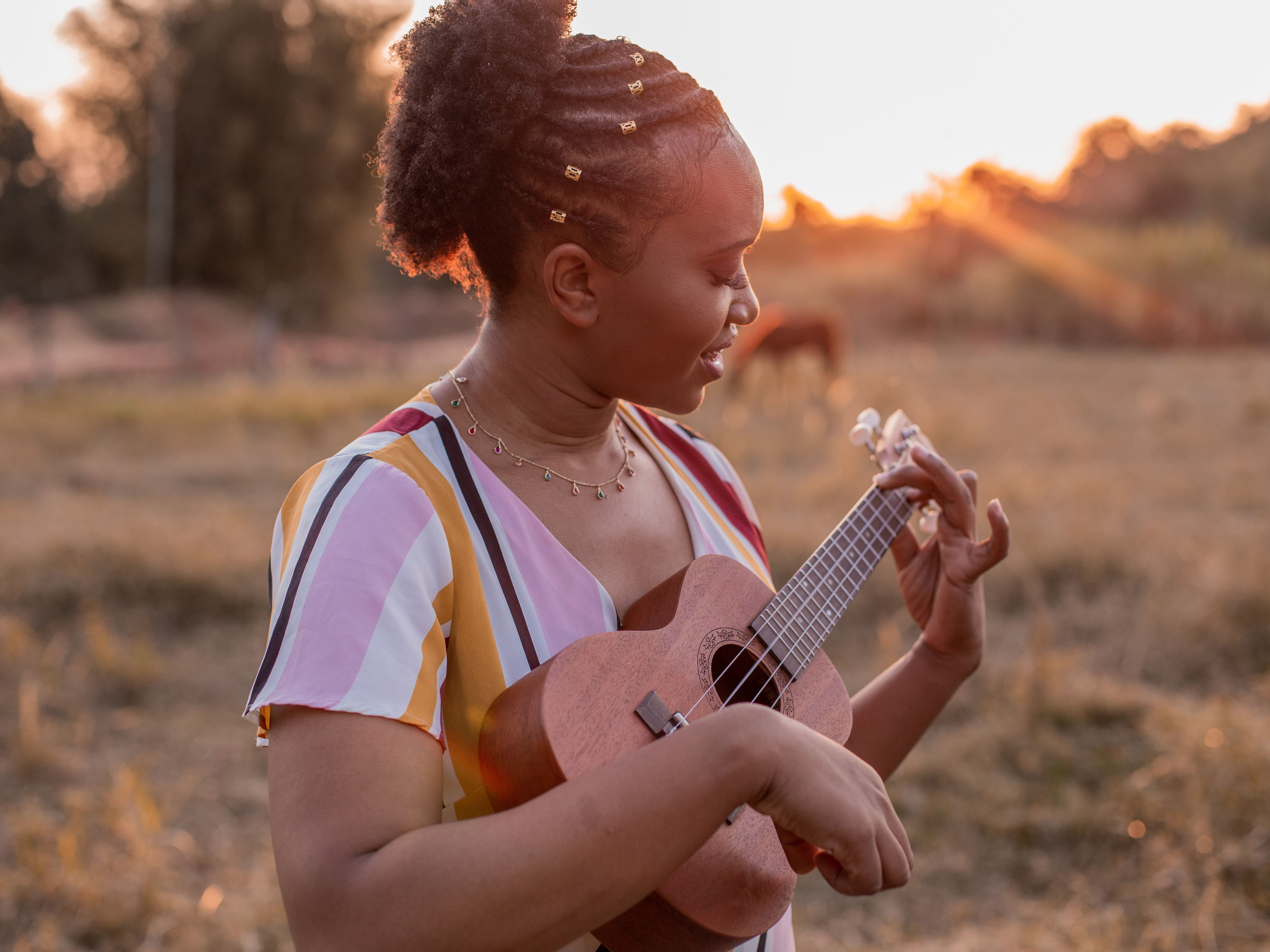 Photo of a Woman Playing Ukulele · Free Stock Photo