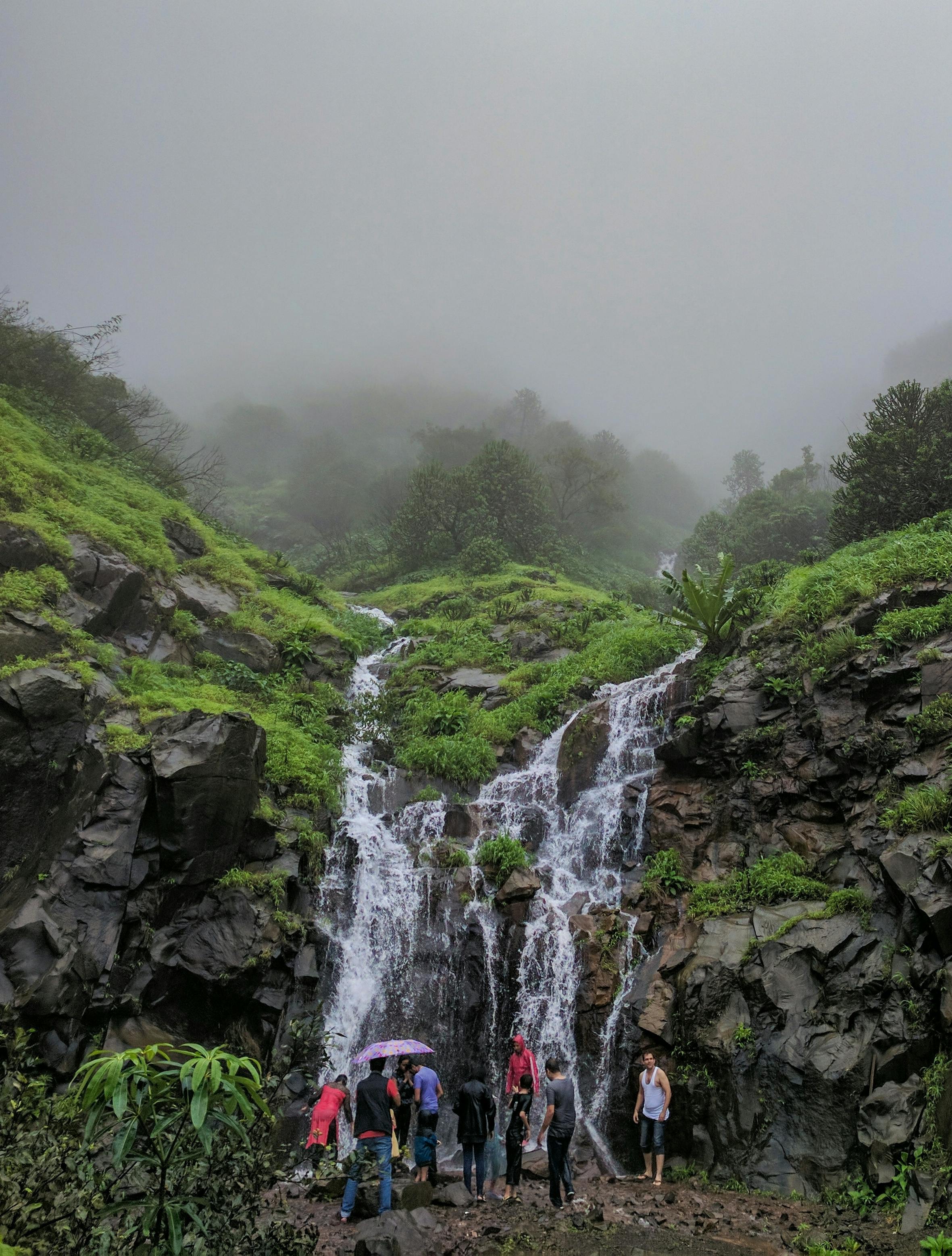 People In Front Of Waterfalls · Free Stock Photo