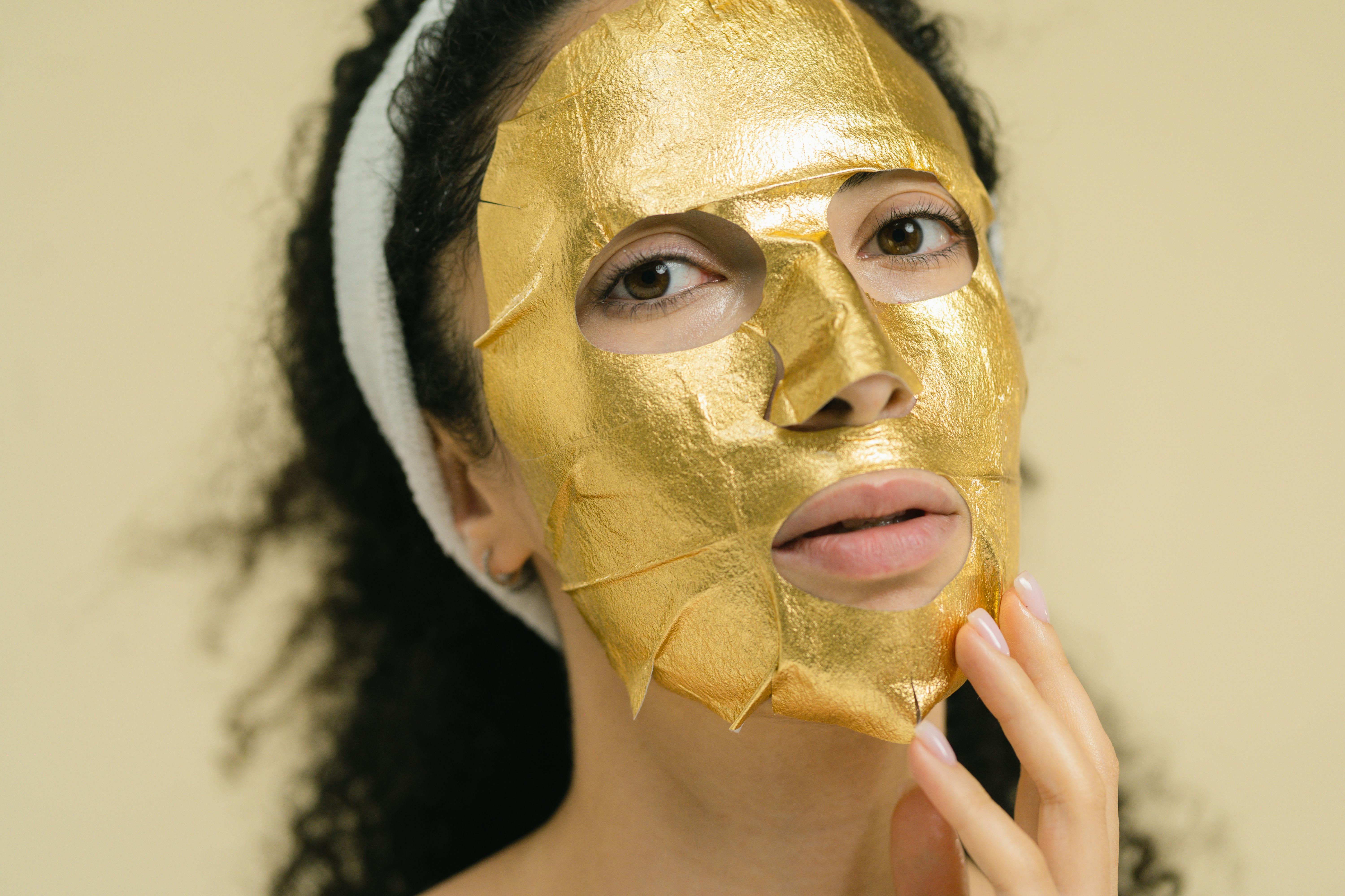 A Woman with a Gold Mask on Her Face · Free Stock Photo