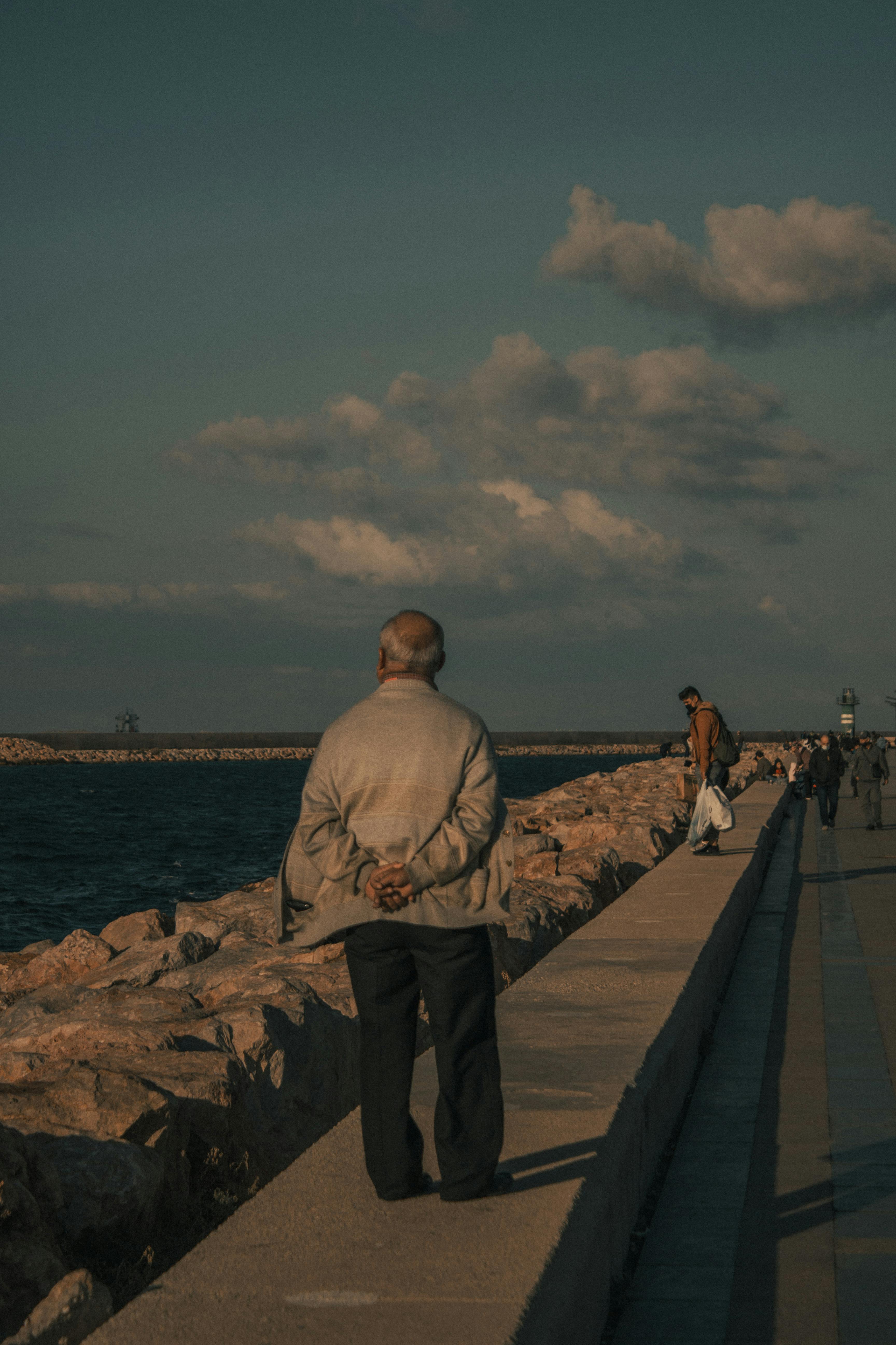 A Man Standing Near the River · Free Stock Photo
