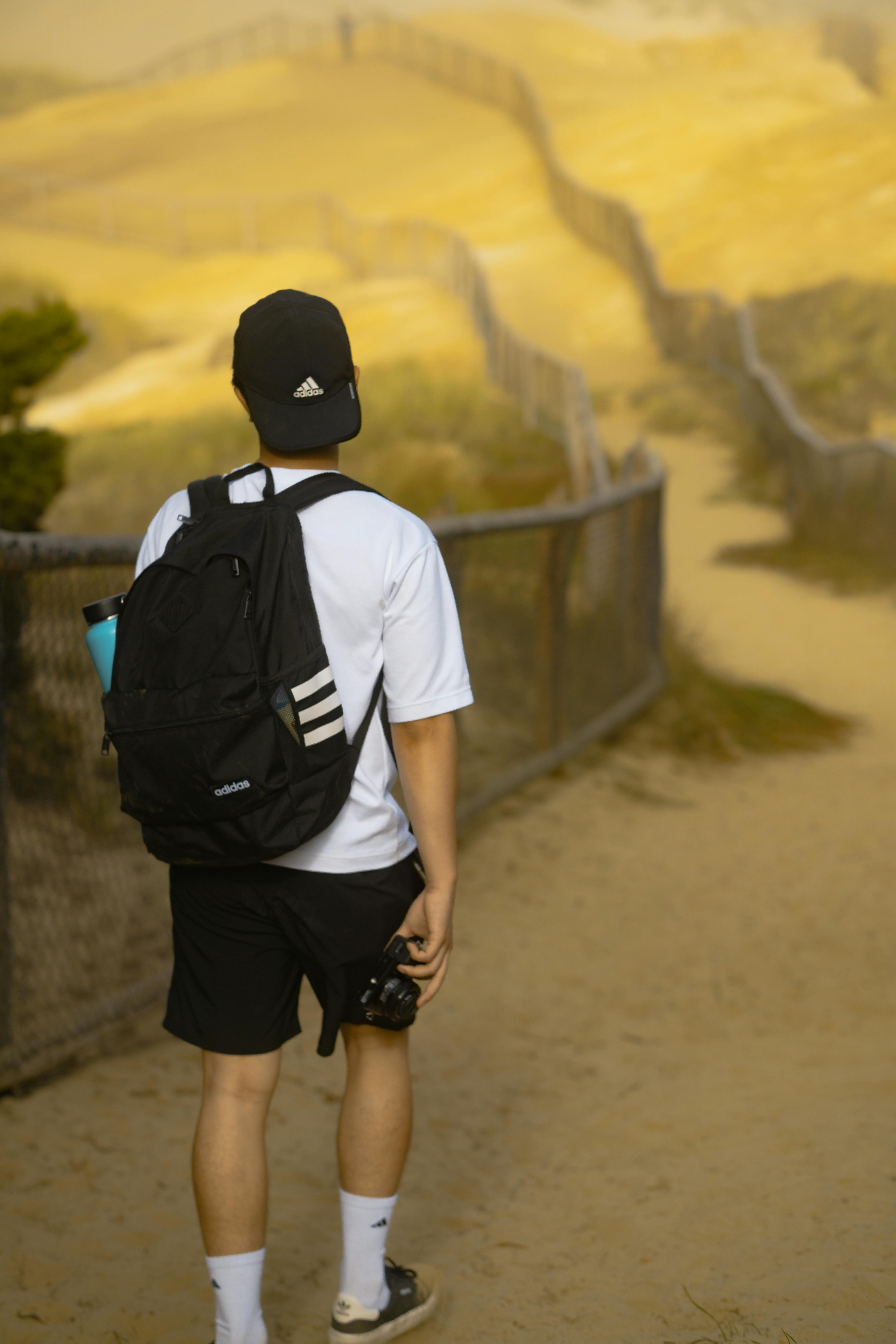 Photo of Man Walking on Road · Free Stock Photo