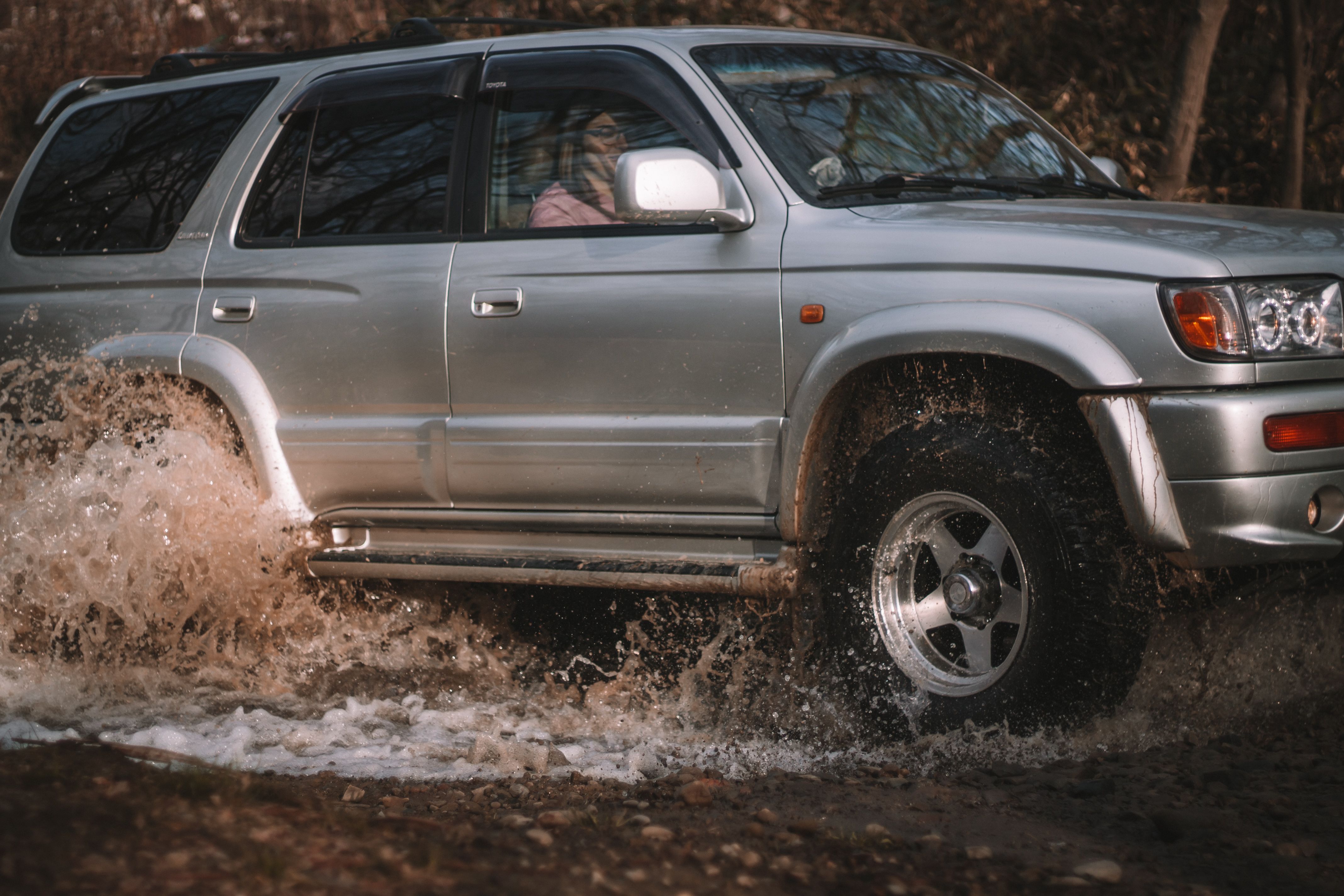Silver SUV Driving on Off Road · Free Stock Photo