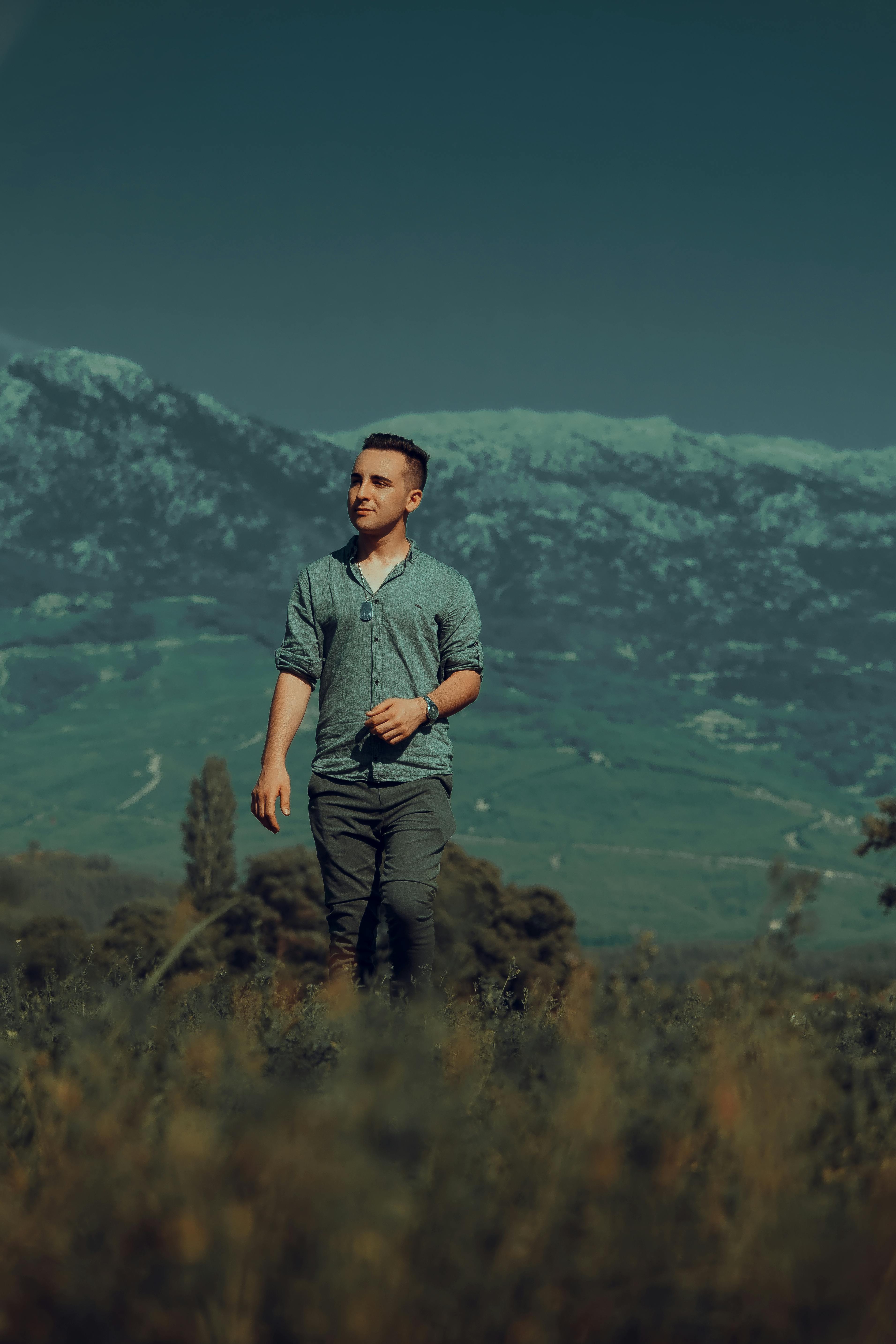 Photo of a Man in Red, Black, and White Plaid Traditional Suit on ...