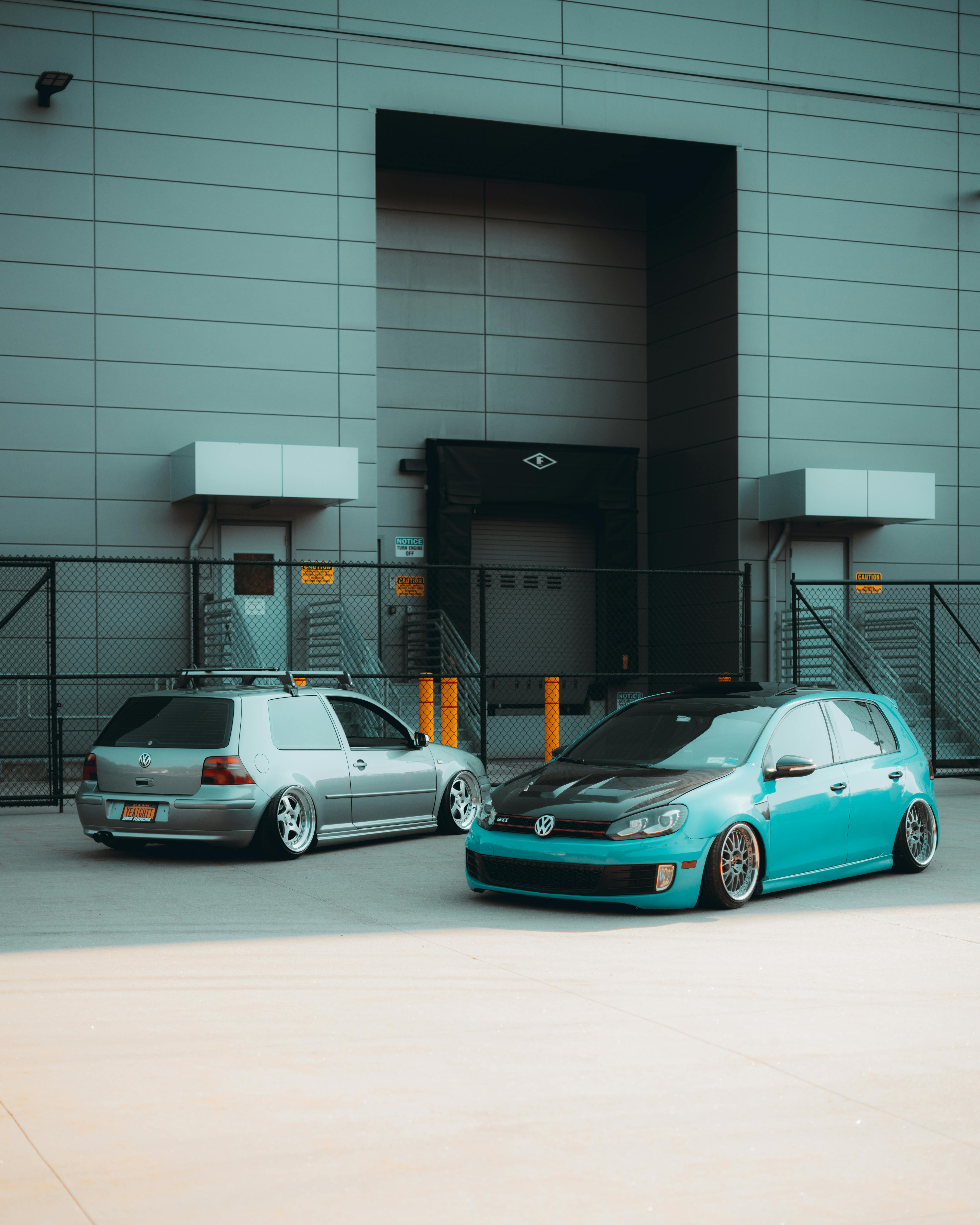Two Cars in Front of a Building · Free Stock Photo