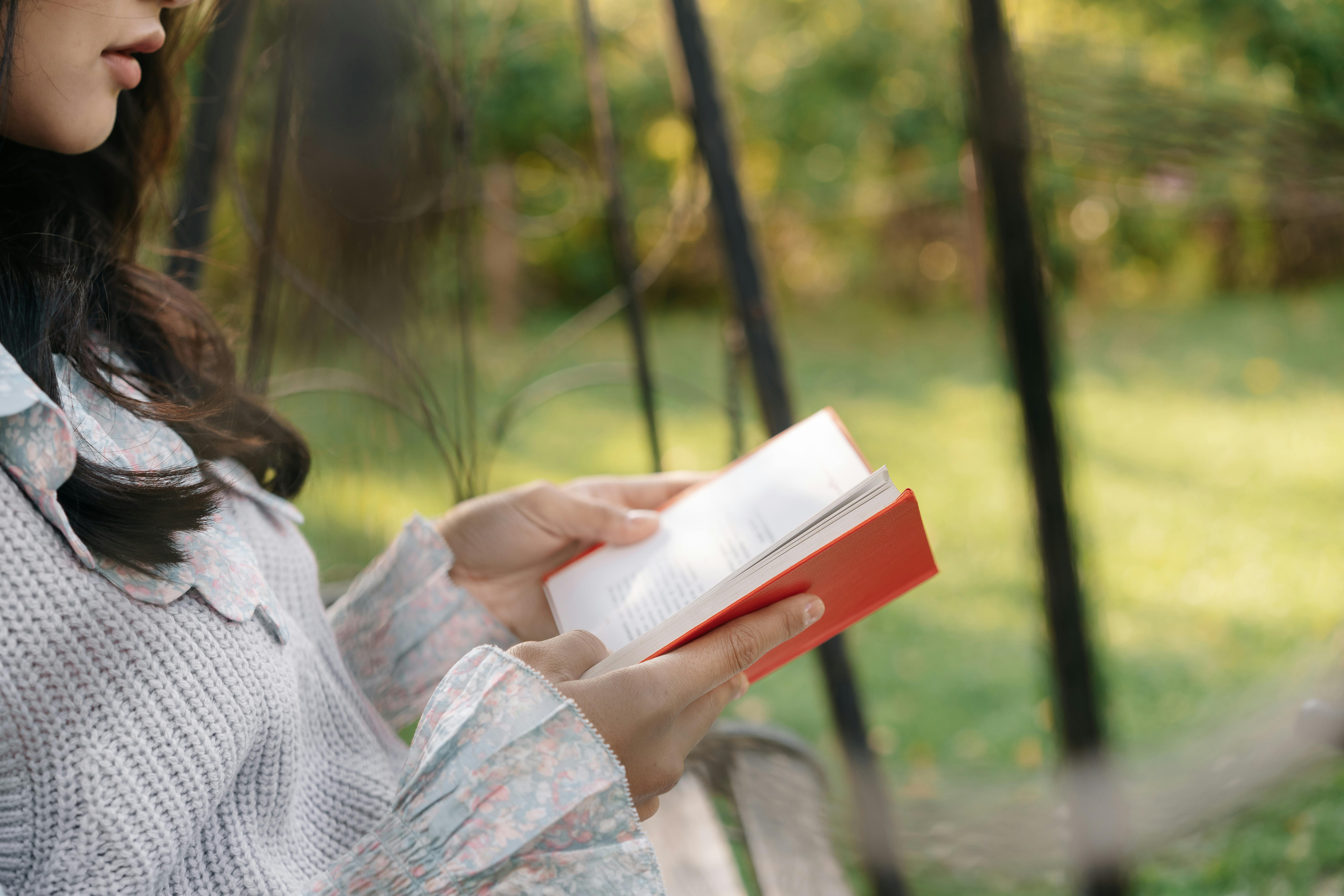 Close-up of a Person Reading a Book · Free Stock Photo