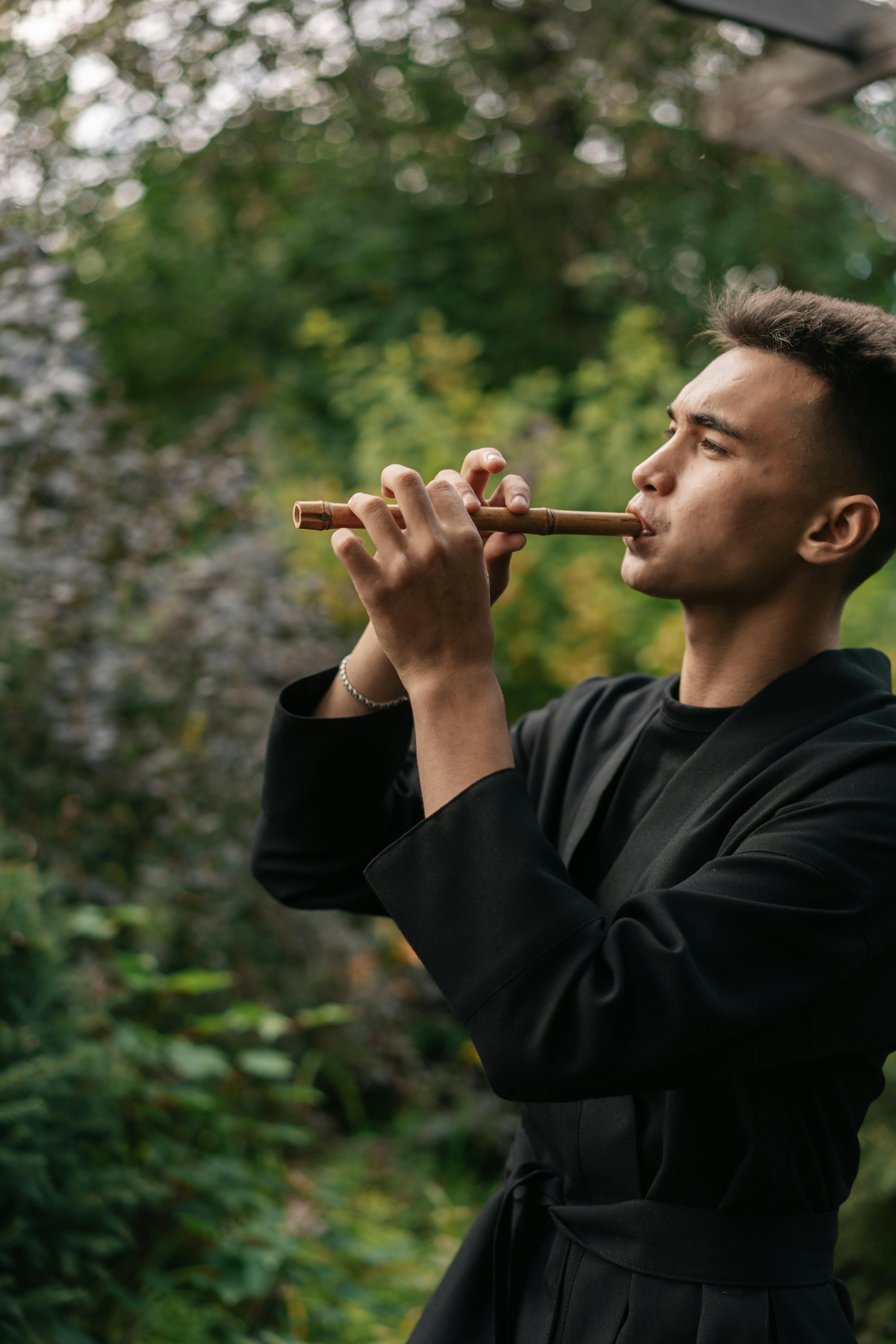 Man Using a Flute · Free Stock Photo