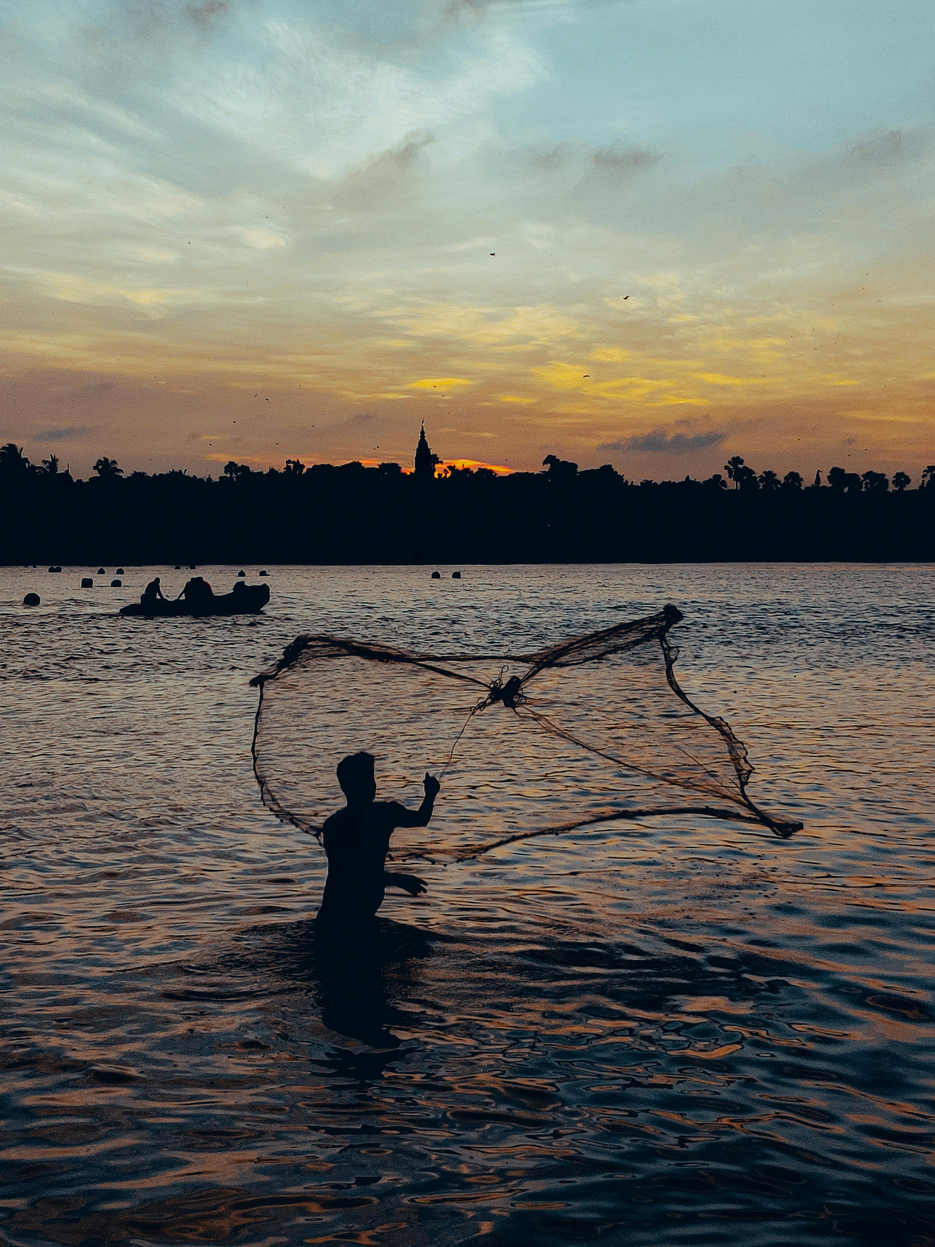 Man Throwing a Net · Free Stock Photo