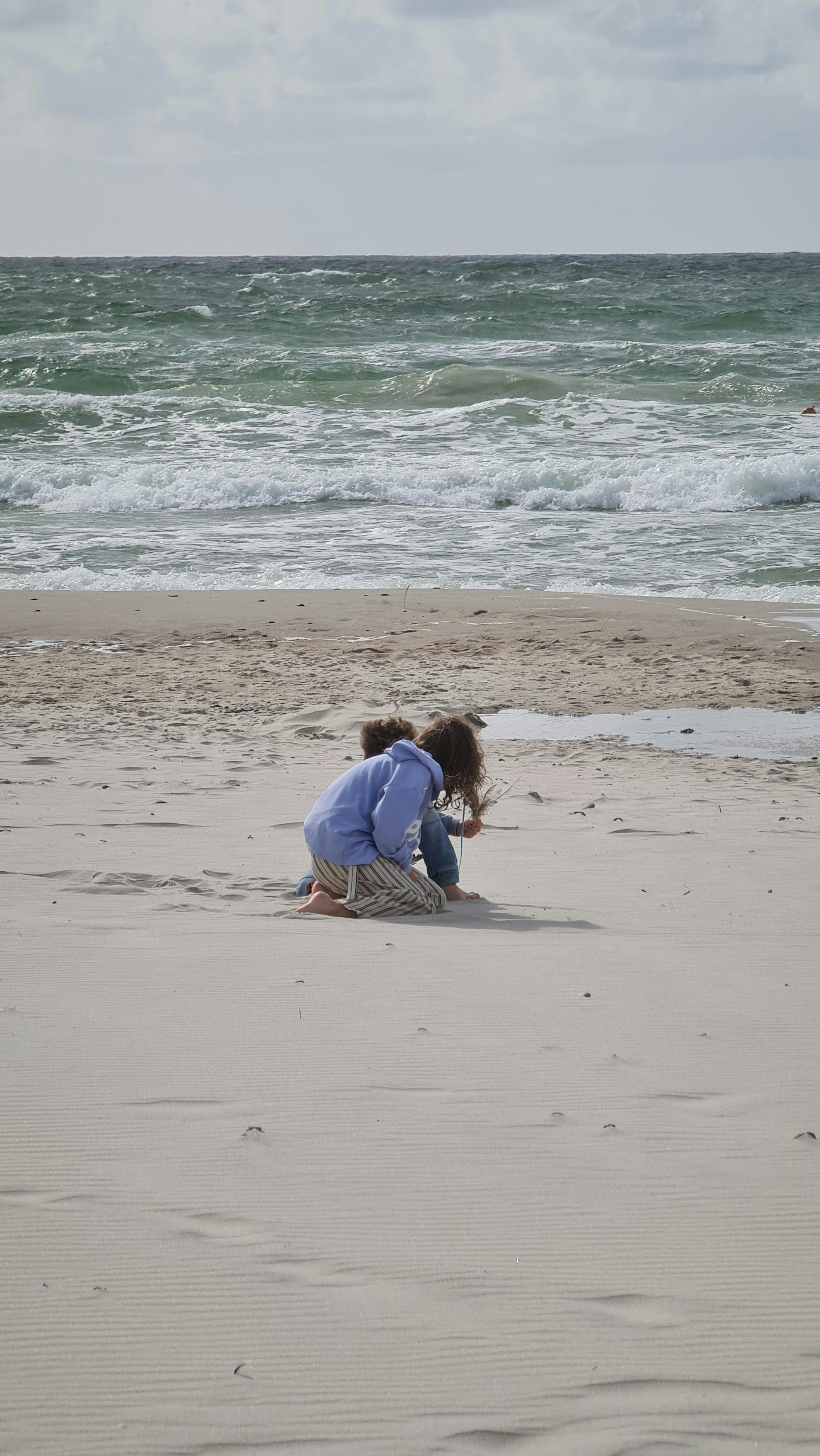 Kids Sitting on the Beach · Free Stock Photo
