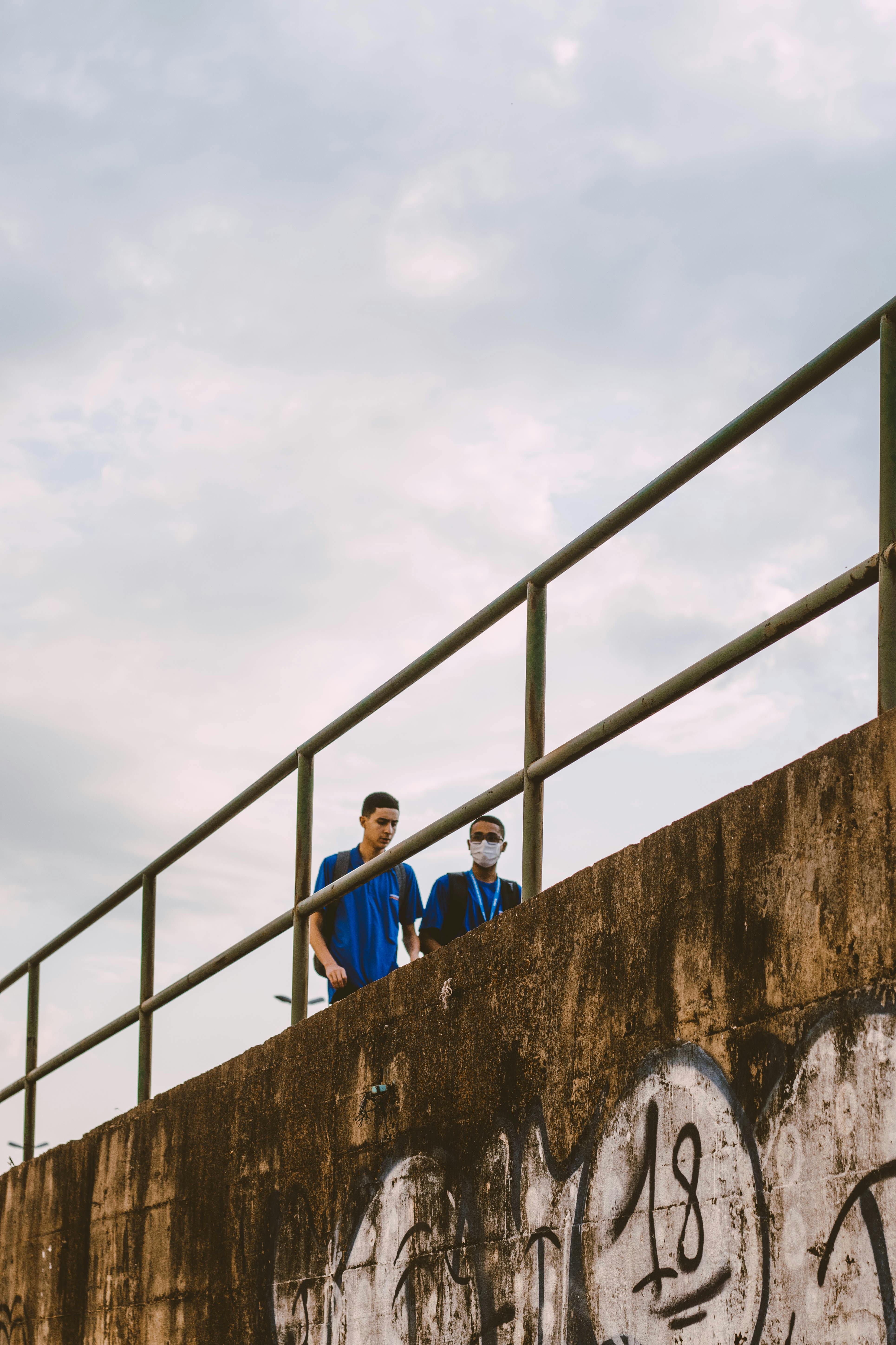 Person Standing on Bridge · Free Stock Photo