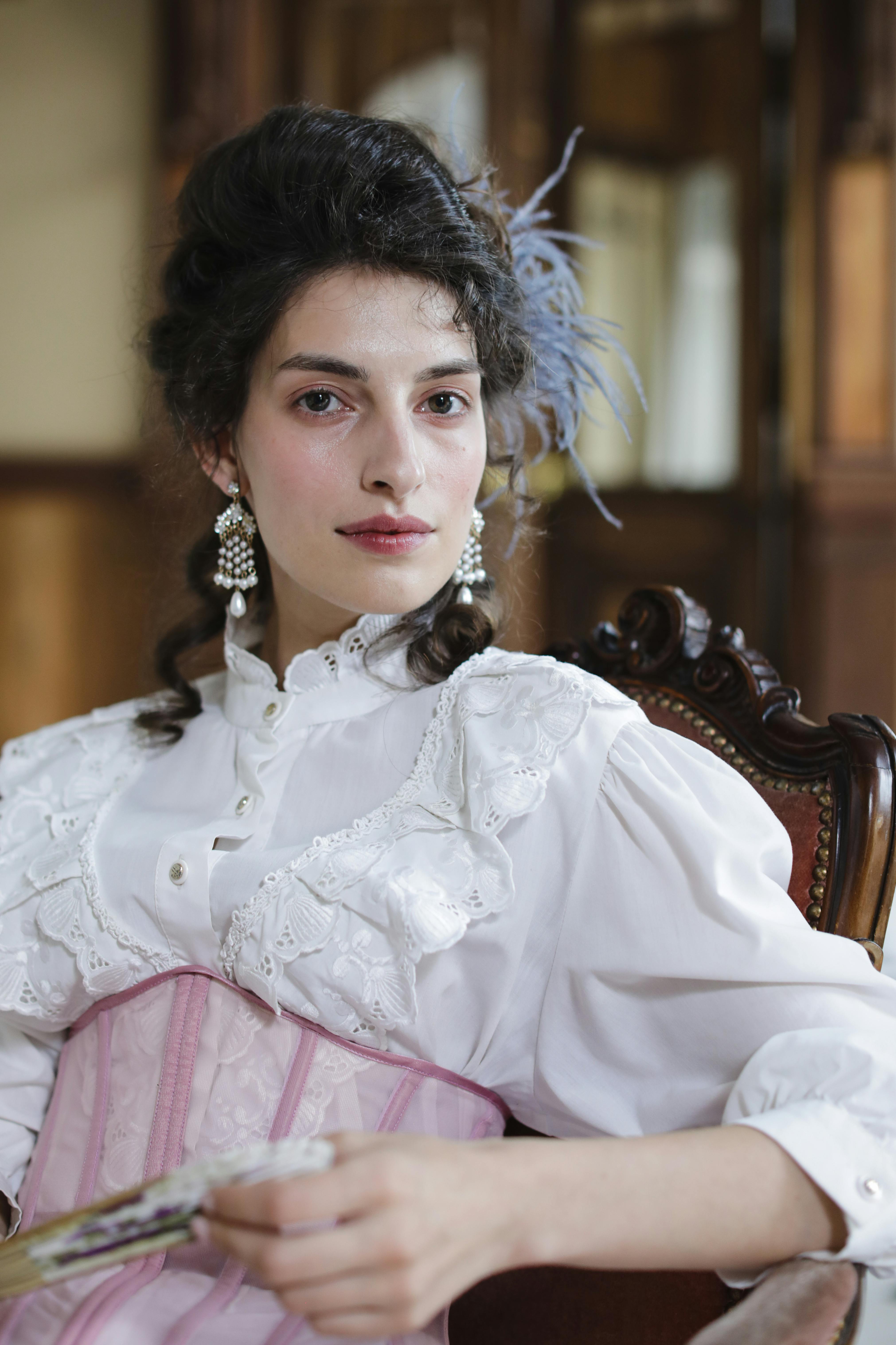 Women Reflection on a Wall Mirror · Free Stock Photo