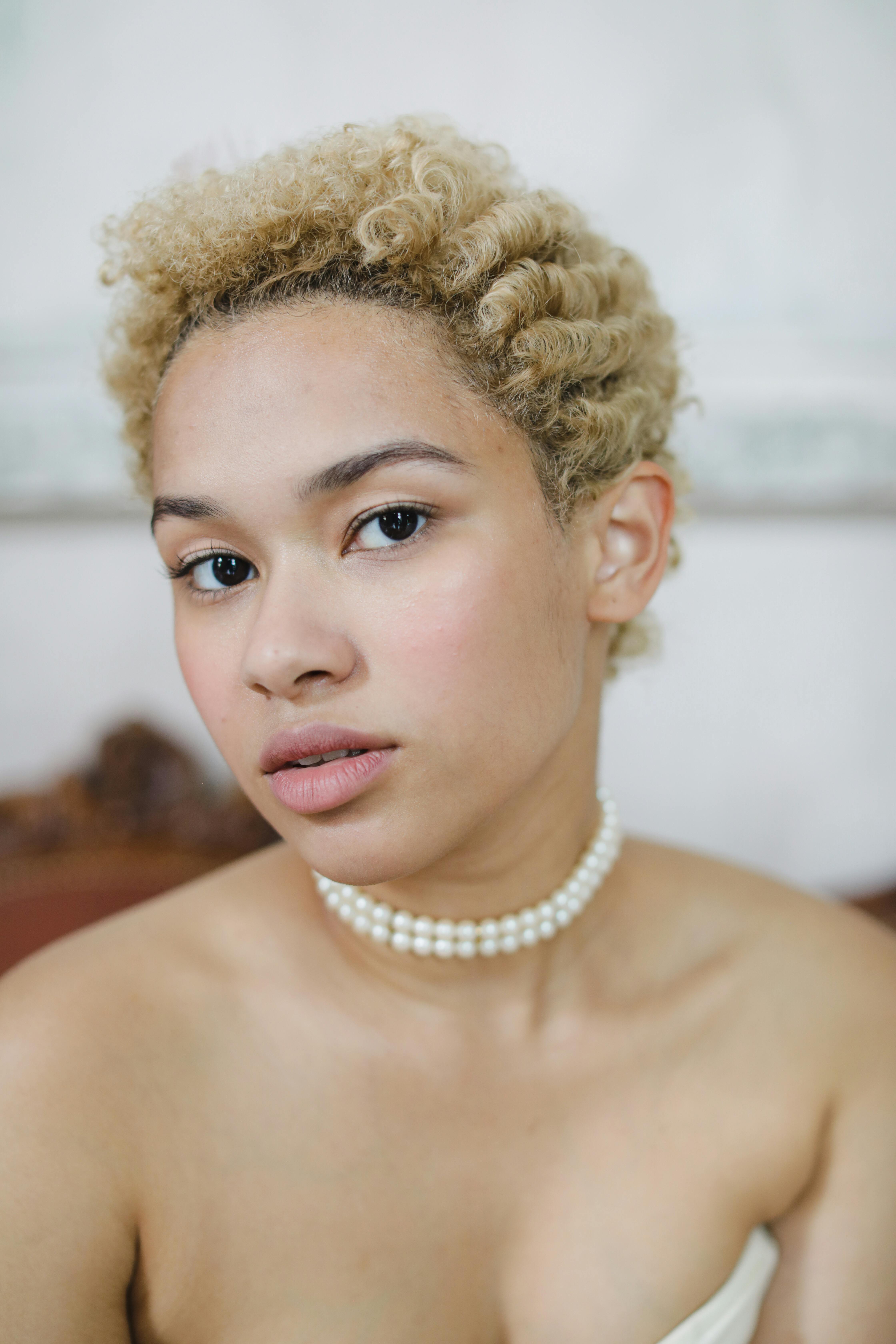 Two Models Posing under Blue and Red Lighting · Free Stock Photo