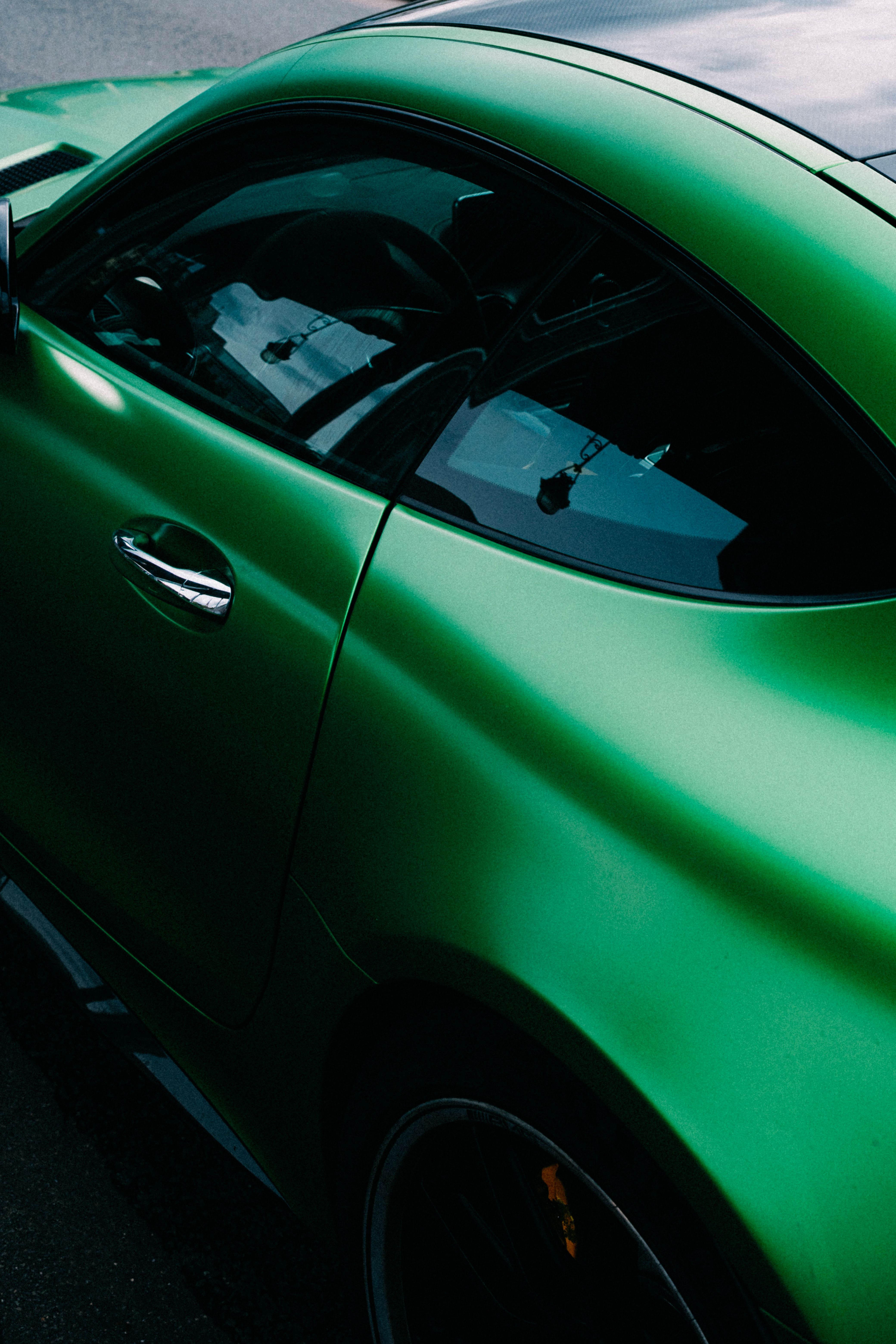 Close-Up Shot of a Green Car · Free Stock Photo
