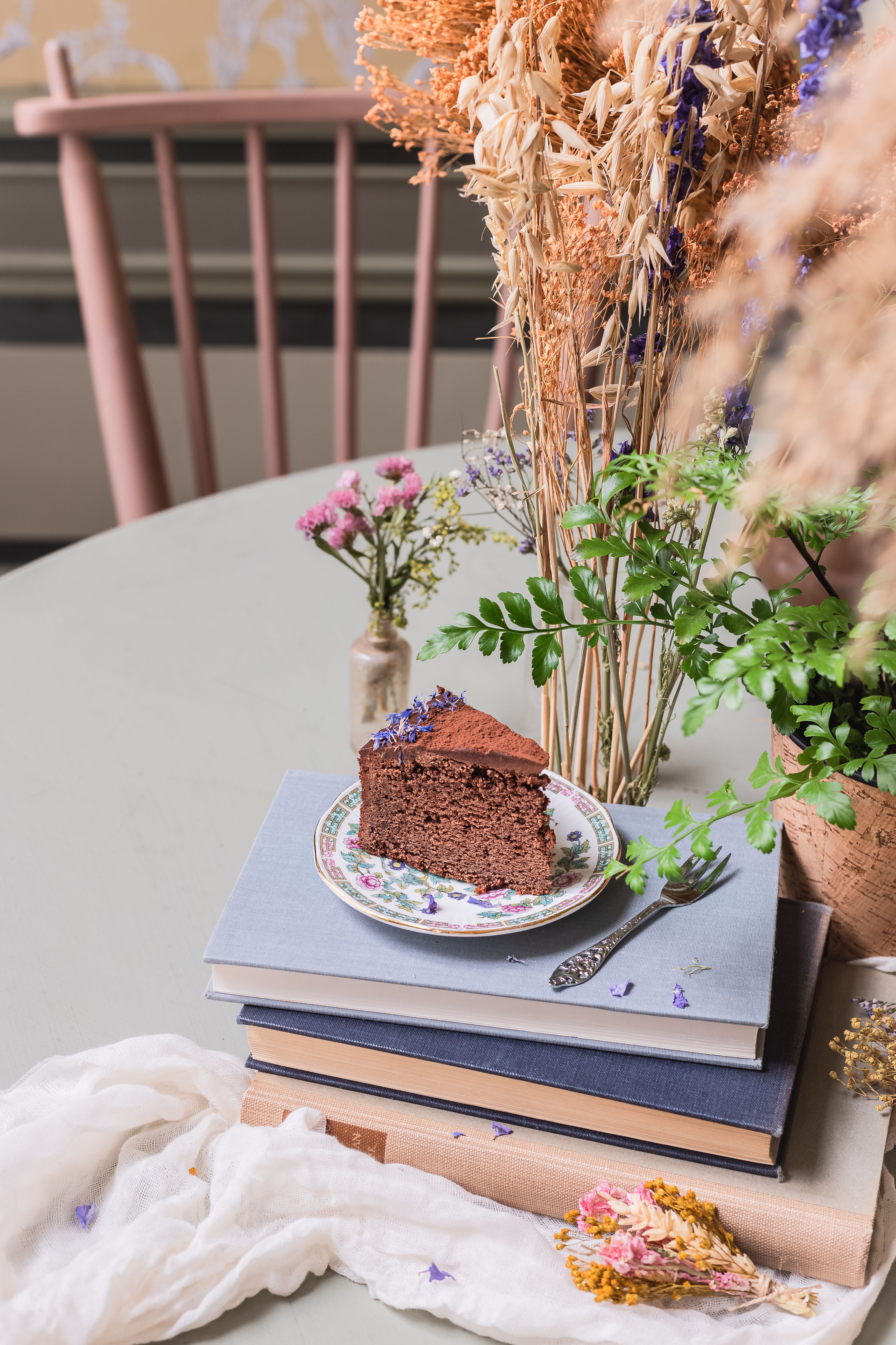 Photo of a Slice of Cake on Top of Books · Free Stock Photo