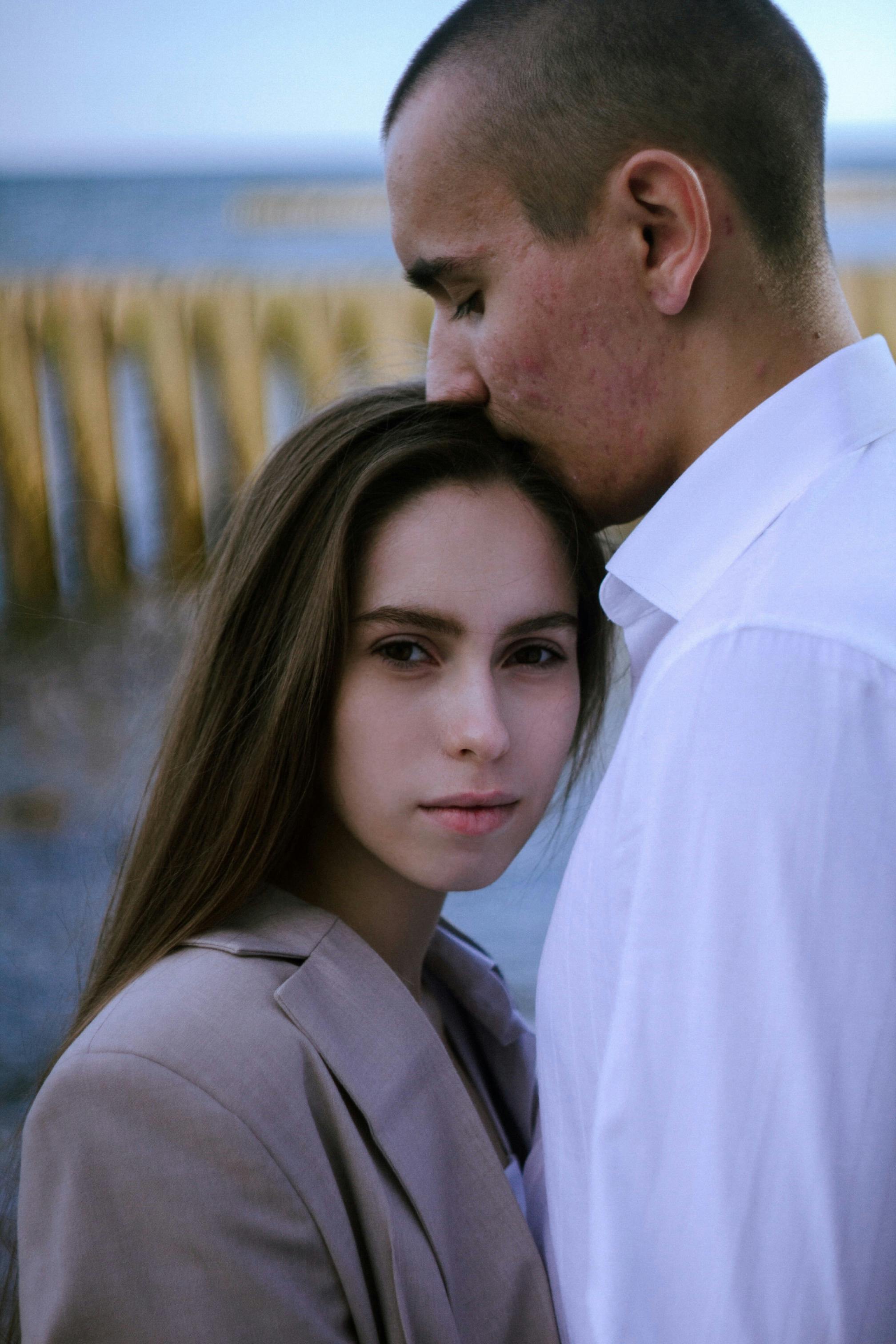 Couple Kissing Under Waterfall · Free Stock Photo