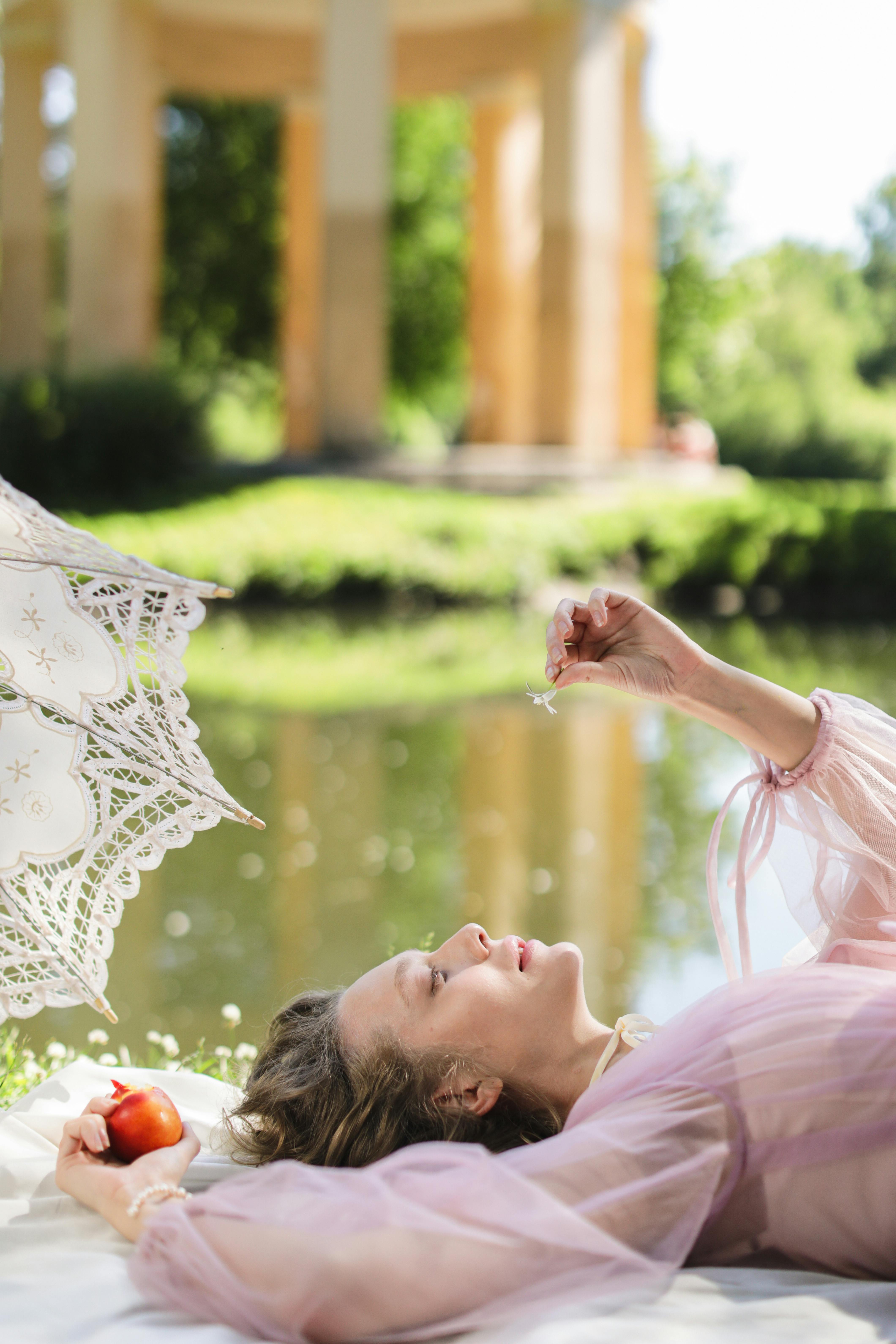 Shallow Focus Photo of a Woman in Pink Dress Lying Down · Free Stock Photo