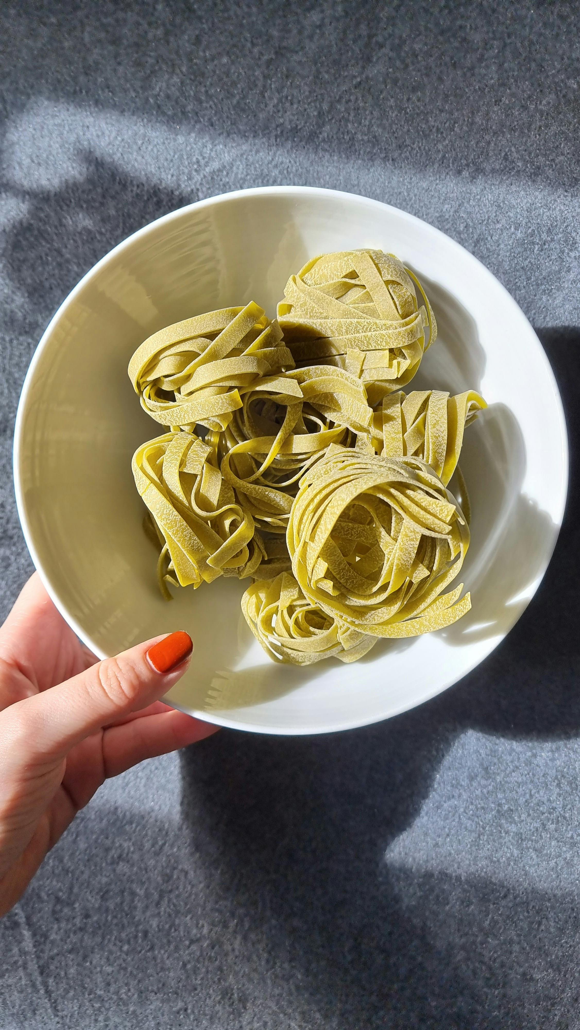 Hand Squeezing a Lemon on a Fish · Free Stock Photo