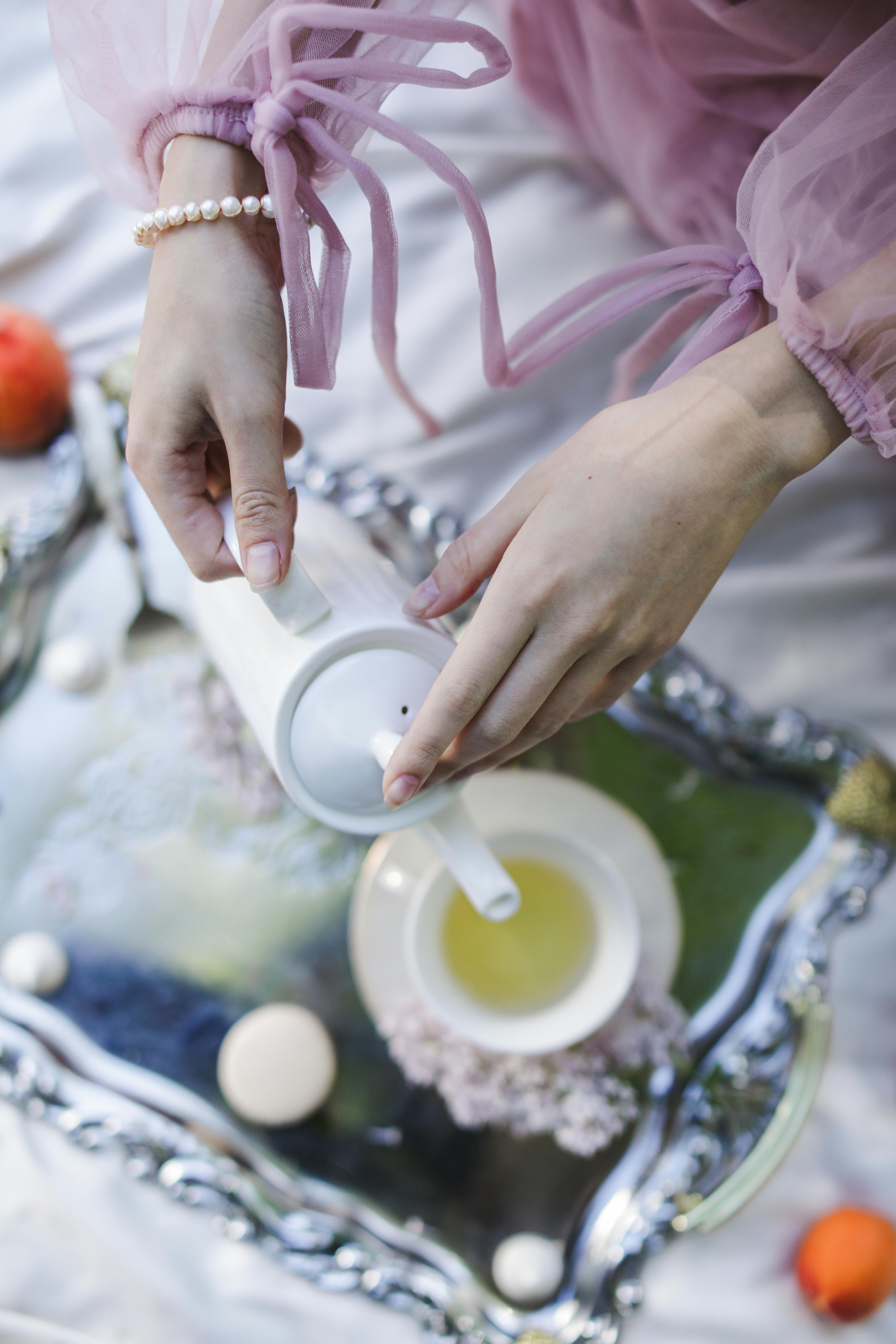 Close-Up Shot of a Person Pouring Drink · Free Stock Photo