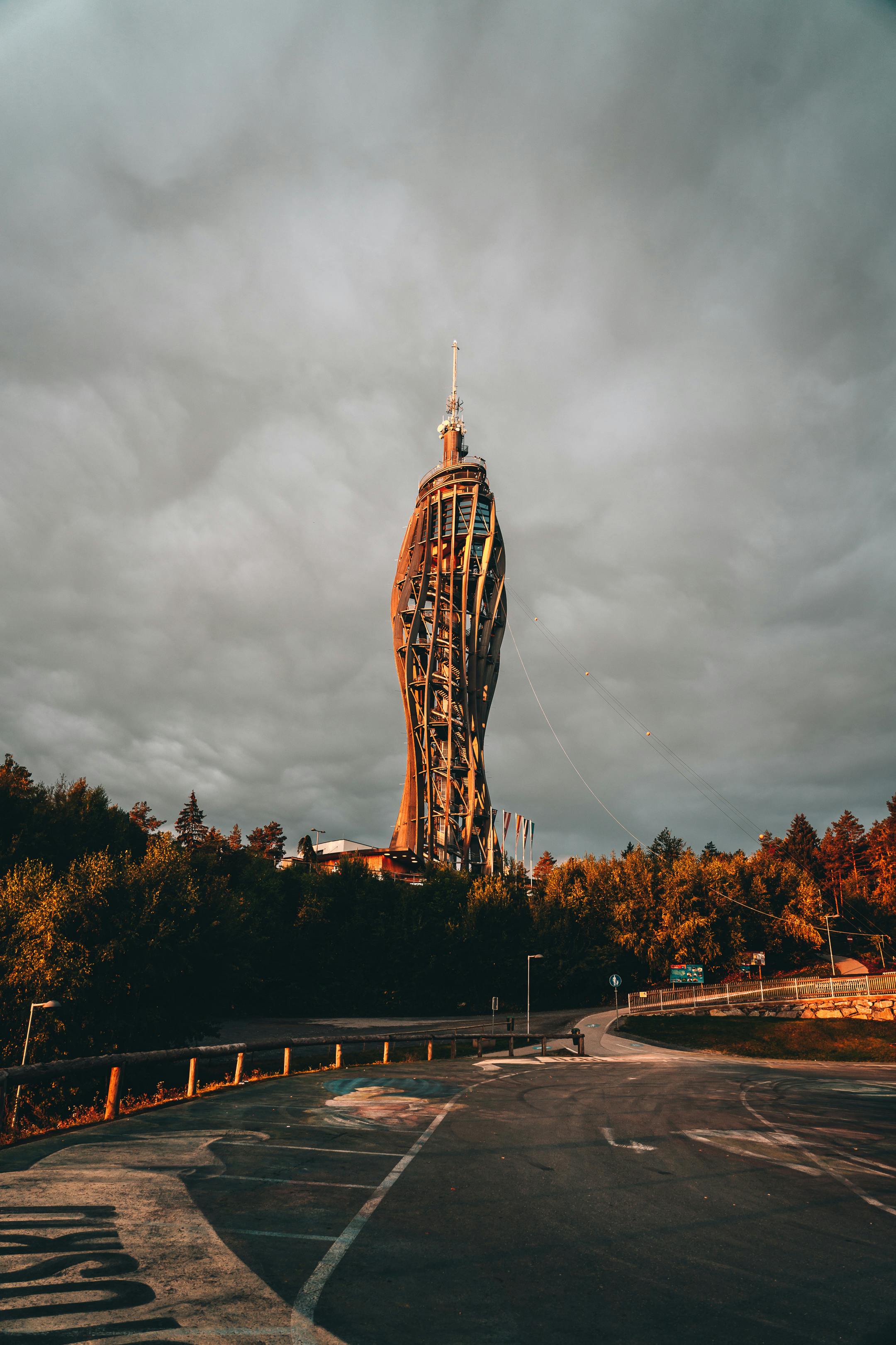 Photo of a Tower against a Cloudy Sky · Free Stock Photo