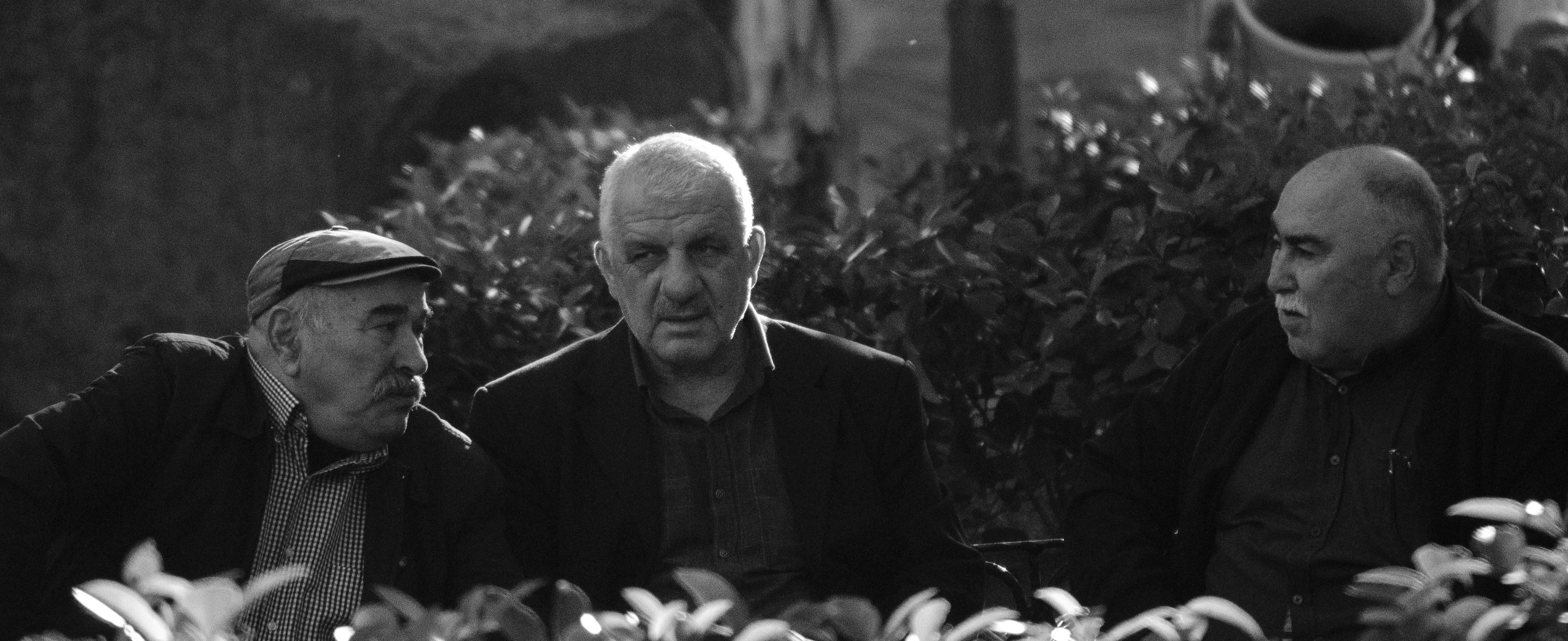 Monochrome Shot of Men in Suit Talking · Free Stock Photo