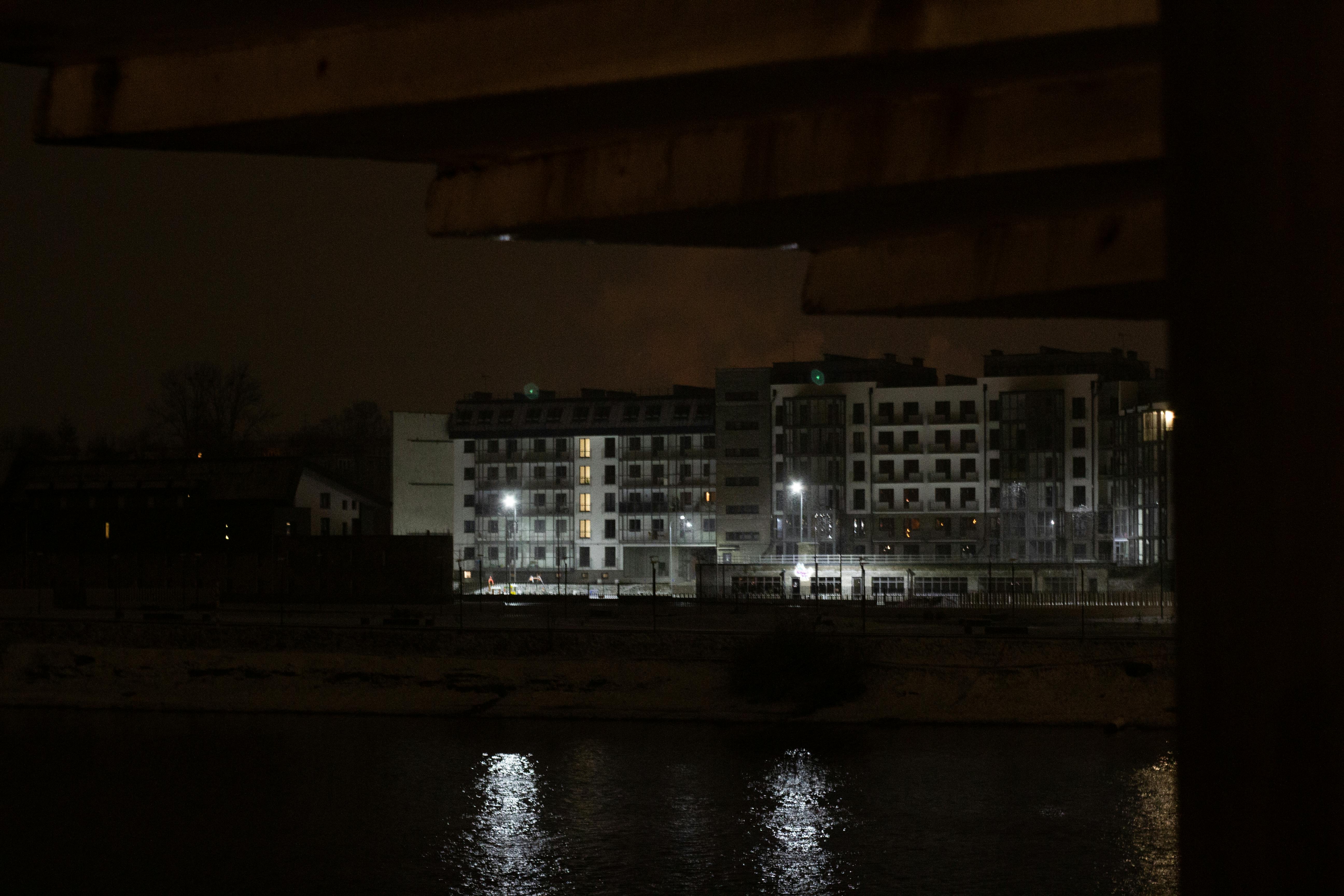 Apartment Building Near the River During Night Time · Free Stock Photo