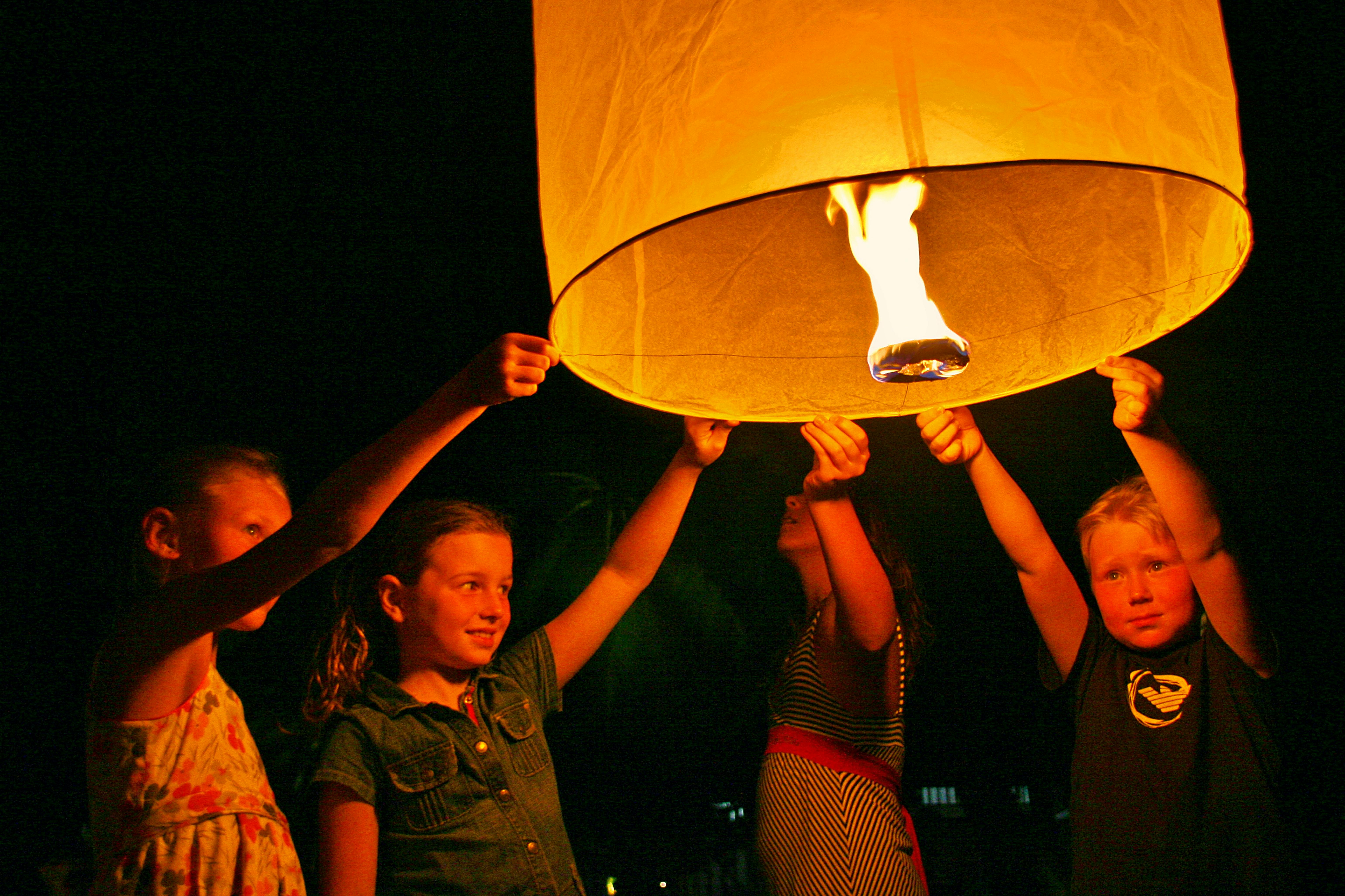 Children Holding a Lantern in the Dark · Free Stock Photo