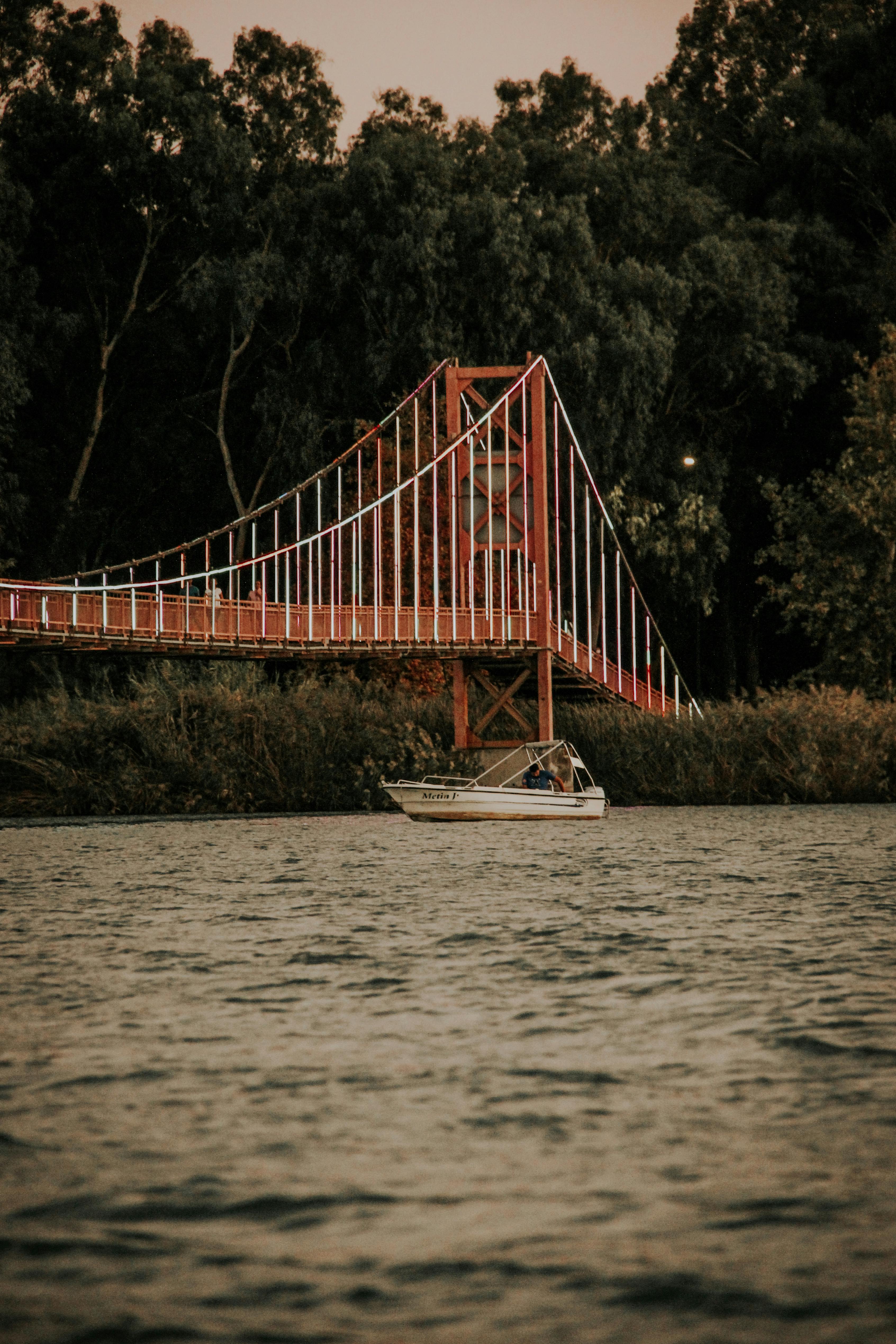 A Sailing Boat Under the Bridge · Free Stock Photo