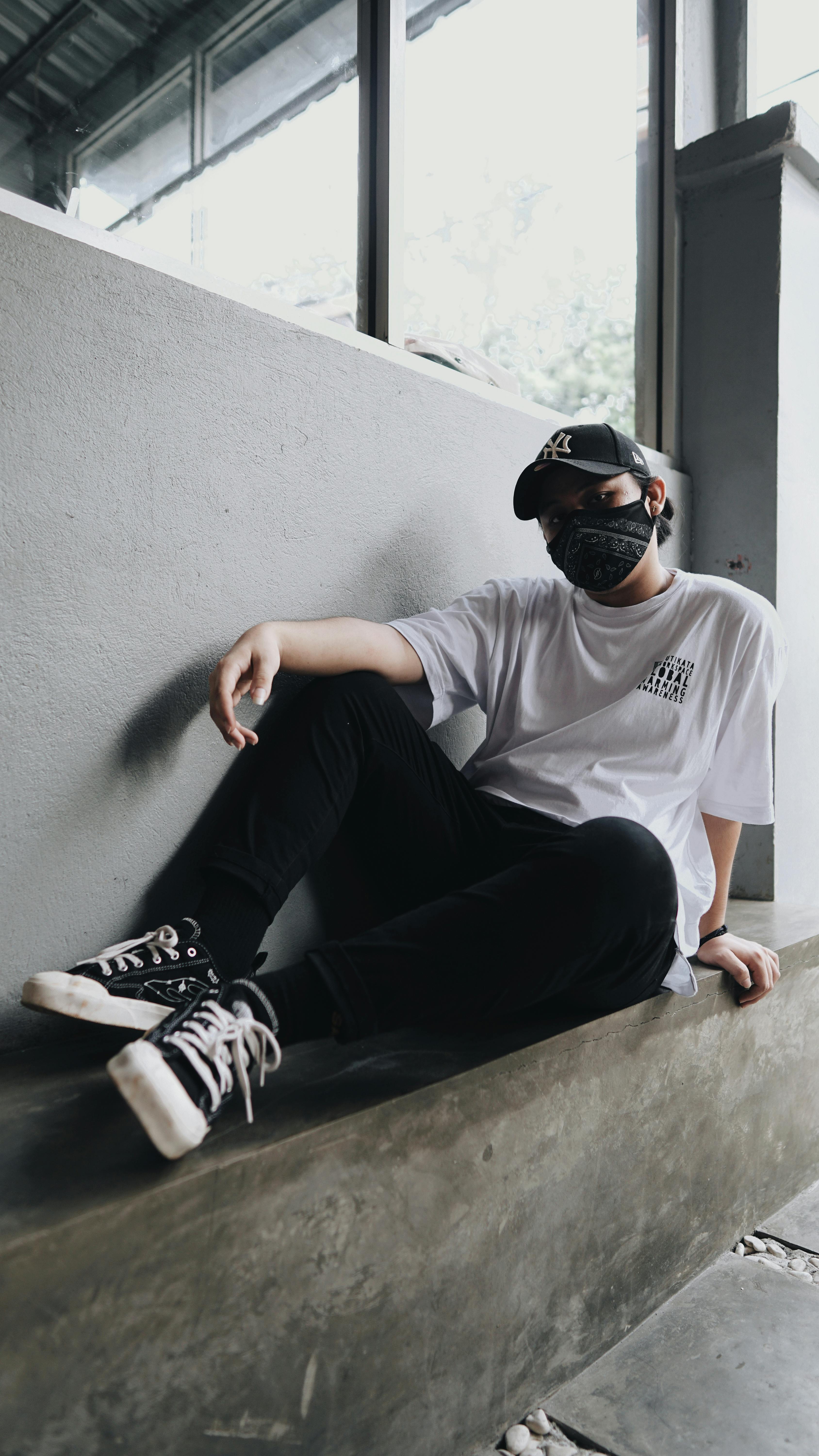 A Person Sitting on the Corner · Free Stock Photo