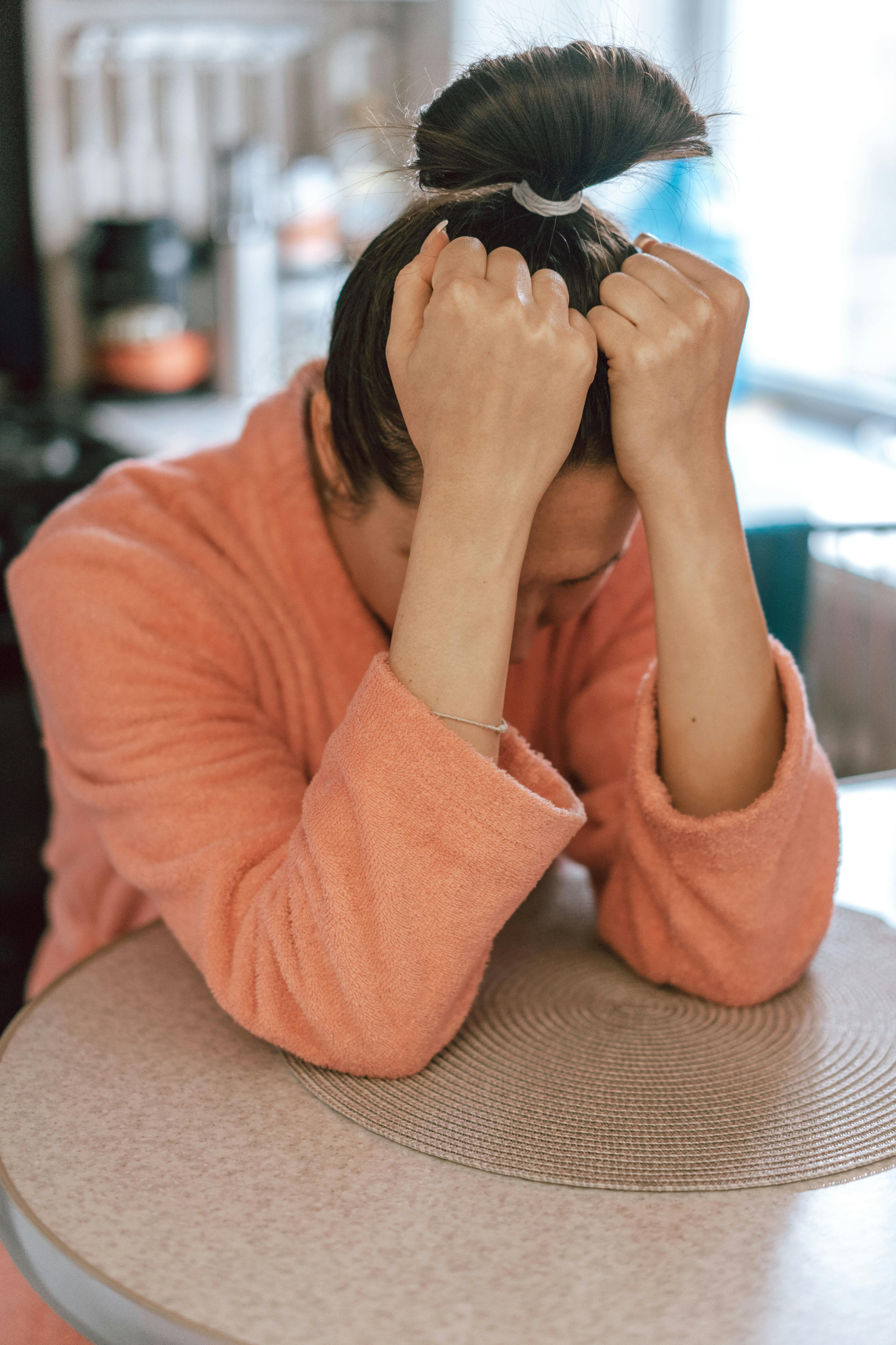 Stressed Woman Wearing a Robe · Free Stock Photo