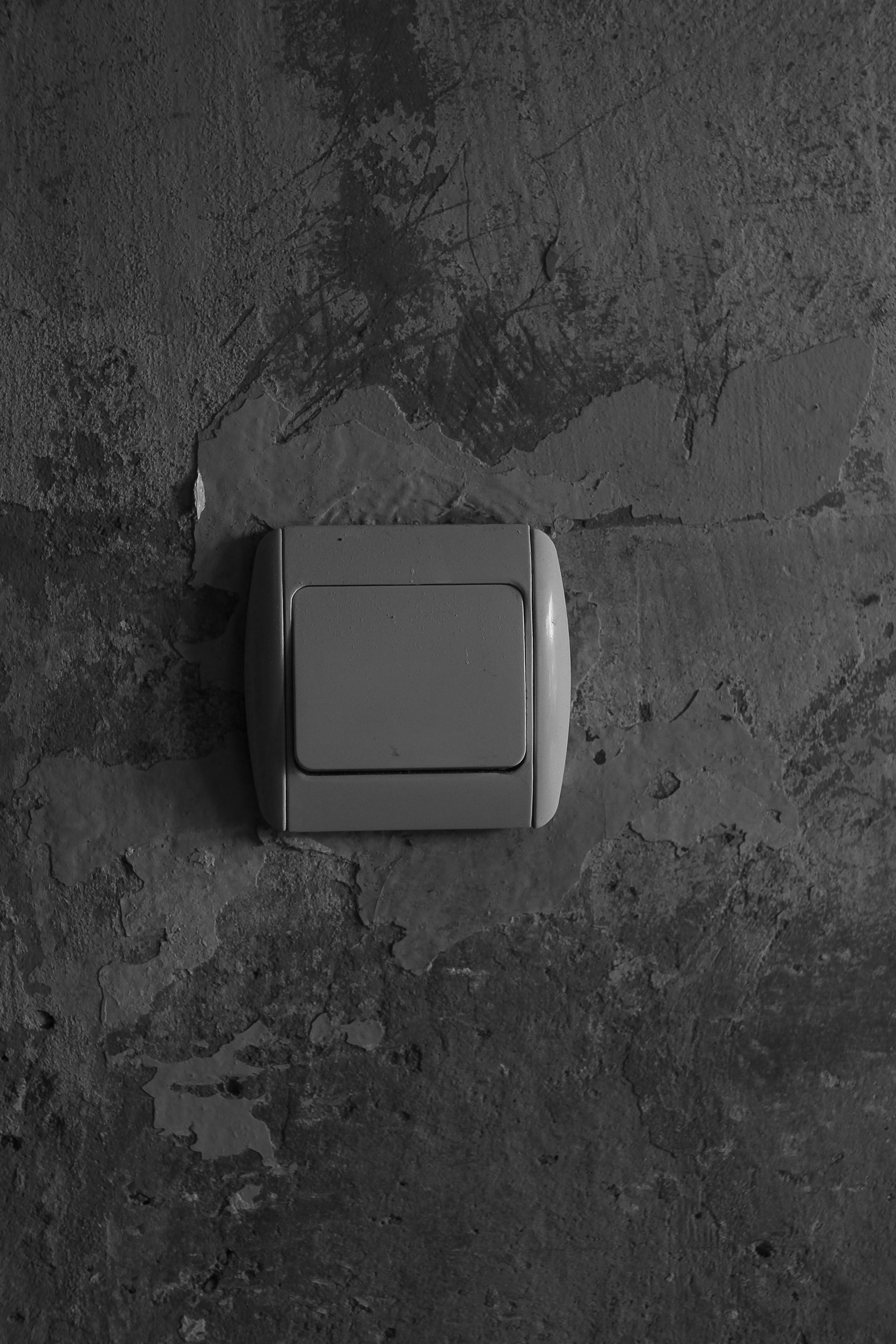 A White Light Switch on a White Wall · Free Stock Photo