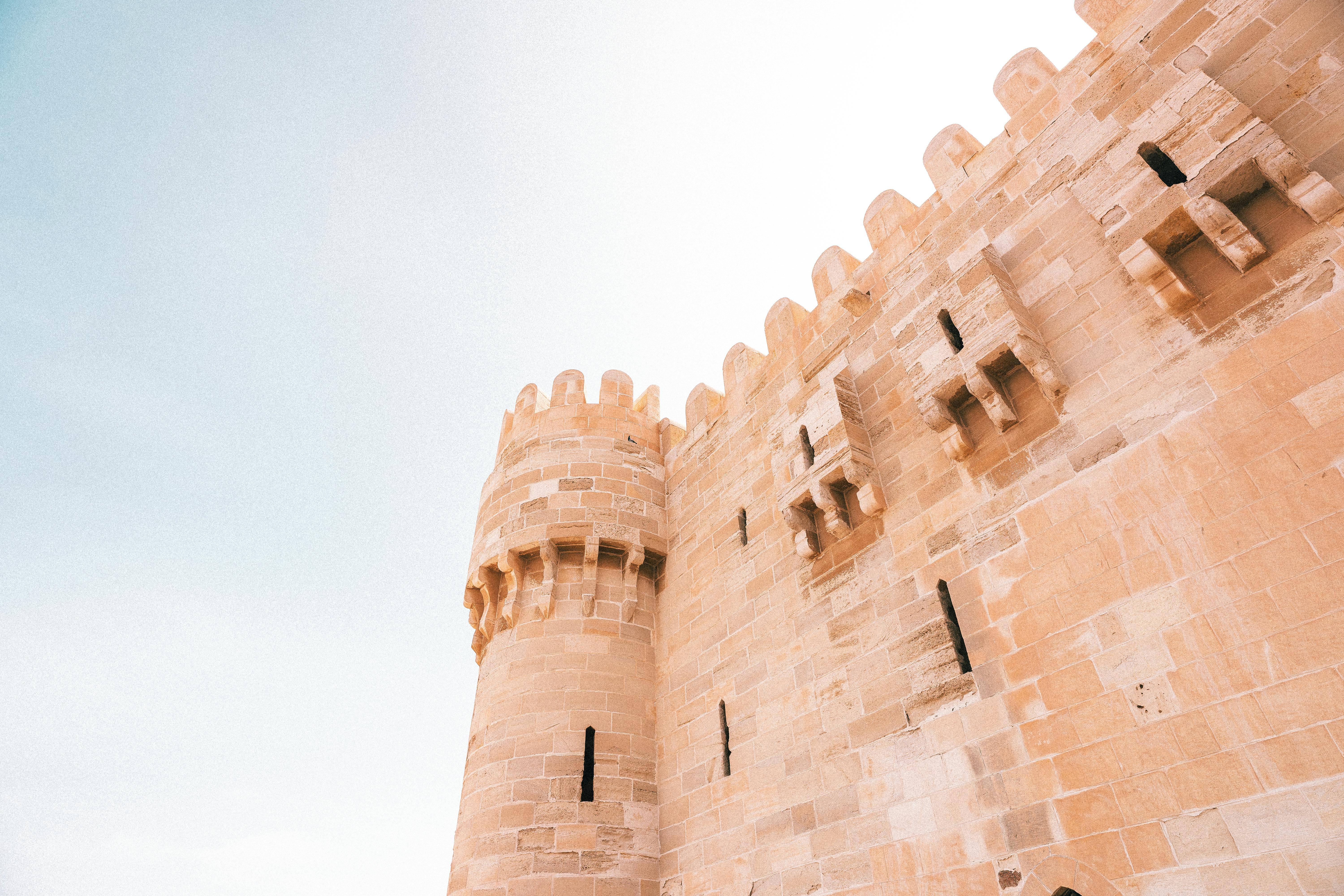 Low-Angle Shot of a Brown Castle · Free Stock Photo