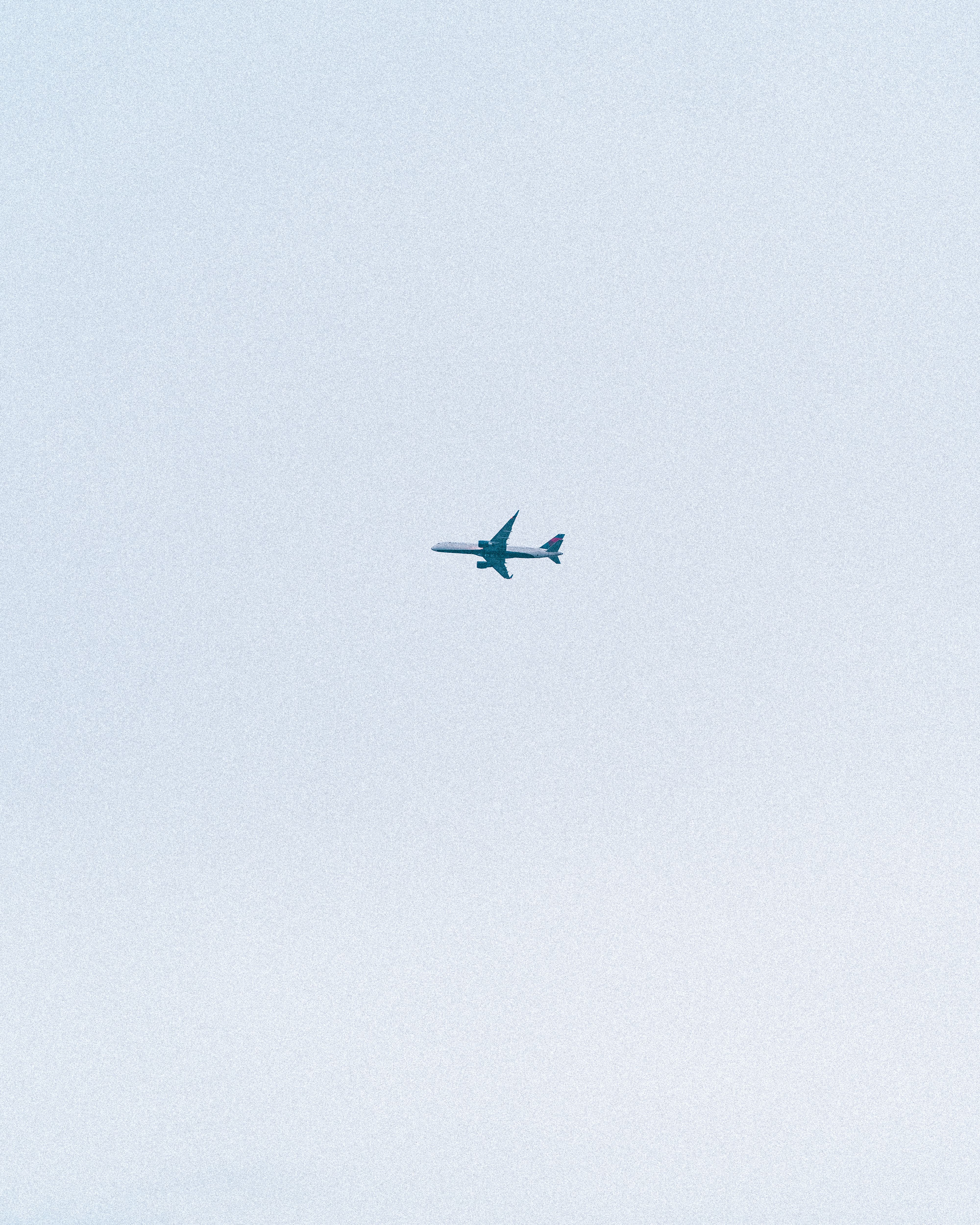 A Blue Airplane Flying in the Sky · Free Stock Photo