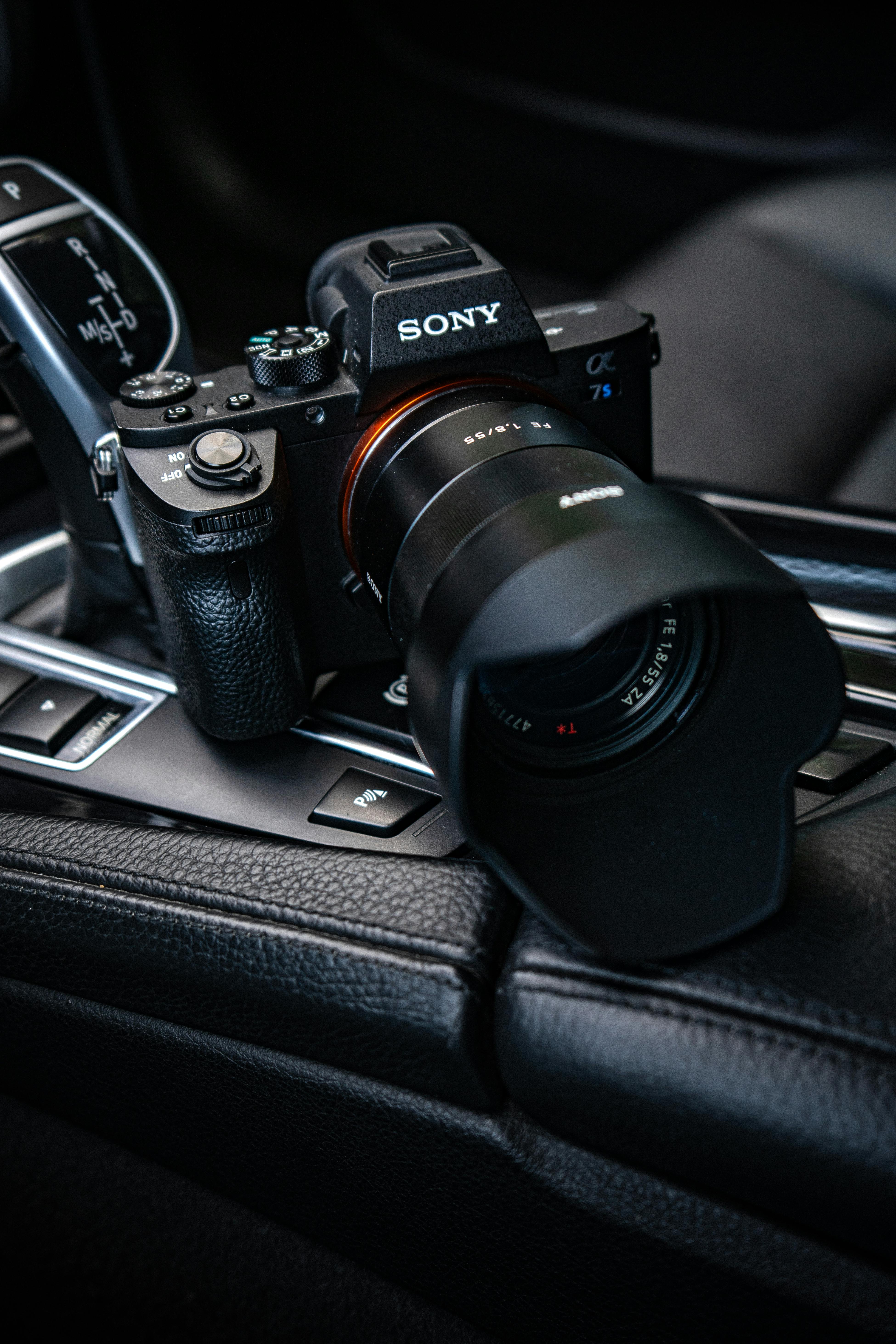 Black Sony Camera on Black Car Panel · Free Stock Photo